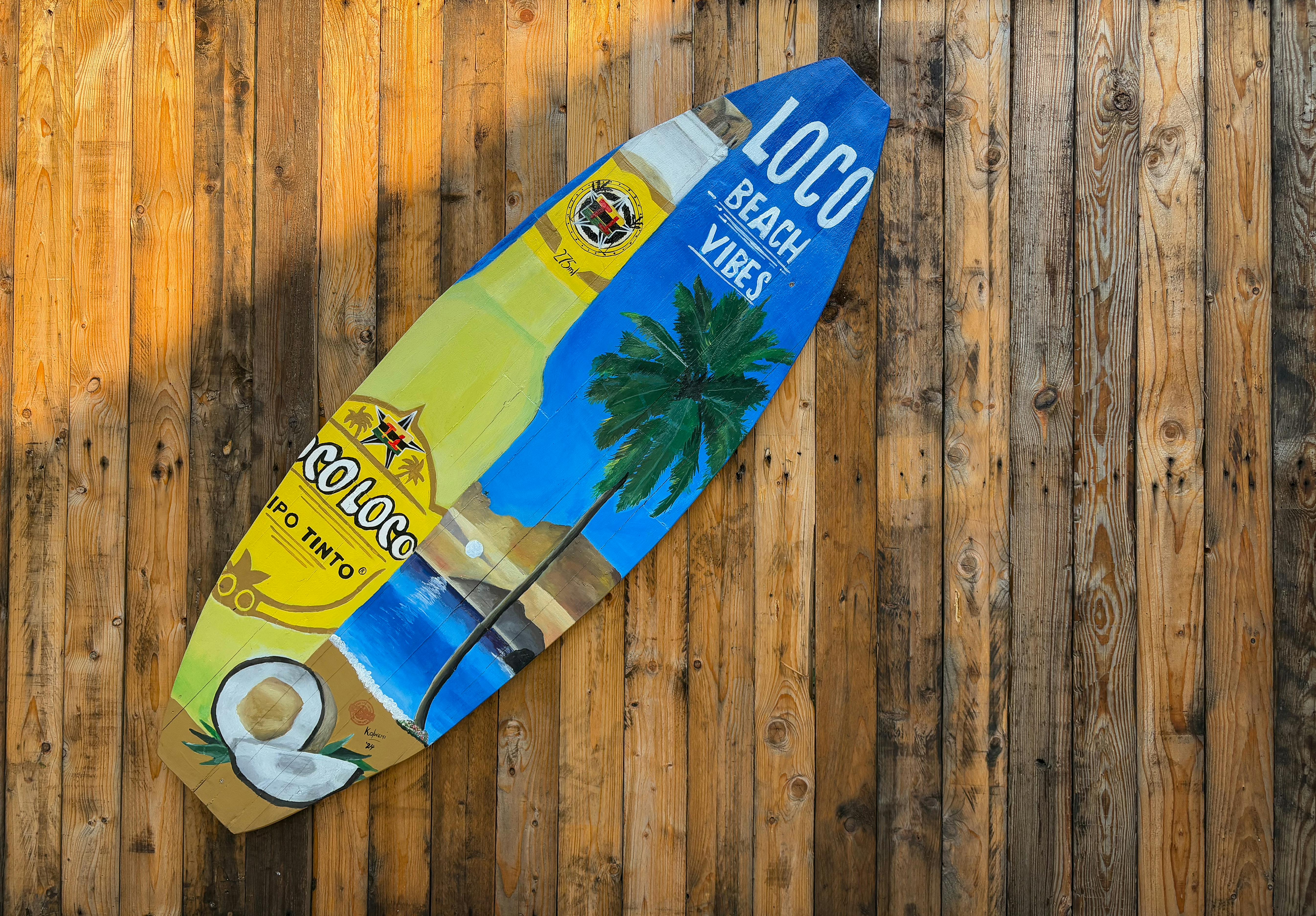 Colorful Painted Surfboard on Rustic Wooden Deck · Free Stock Photo
