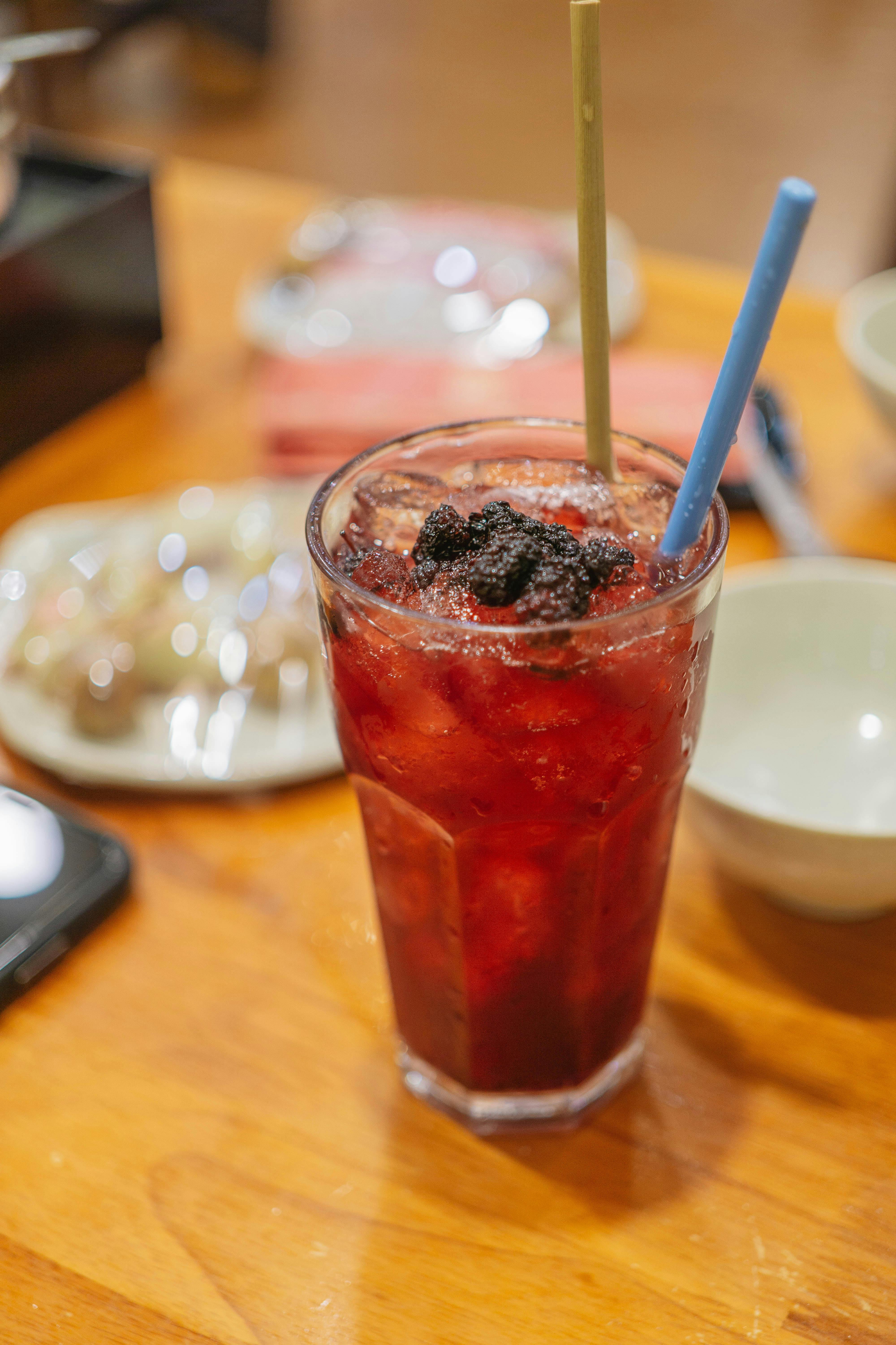 Refreshing Red Berry Iced Drink with Straws · Free Stock Photo