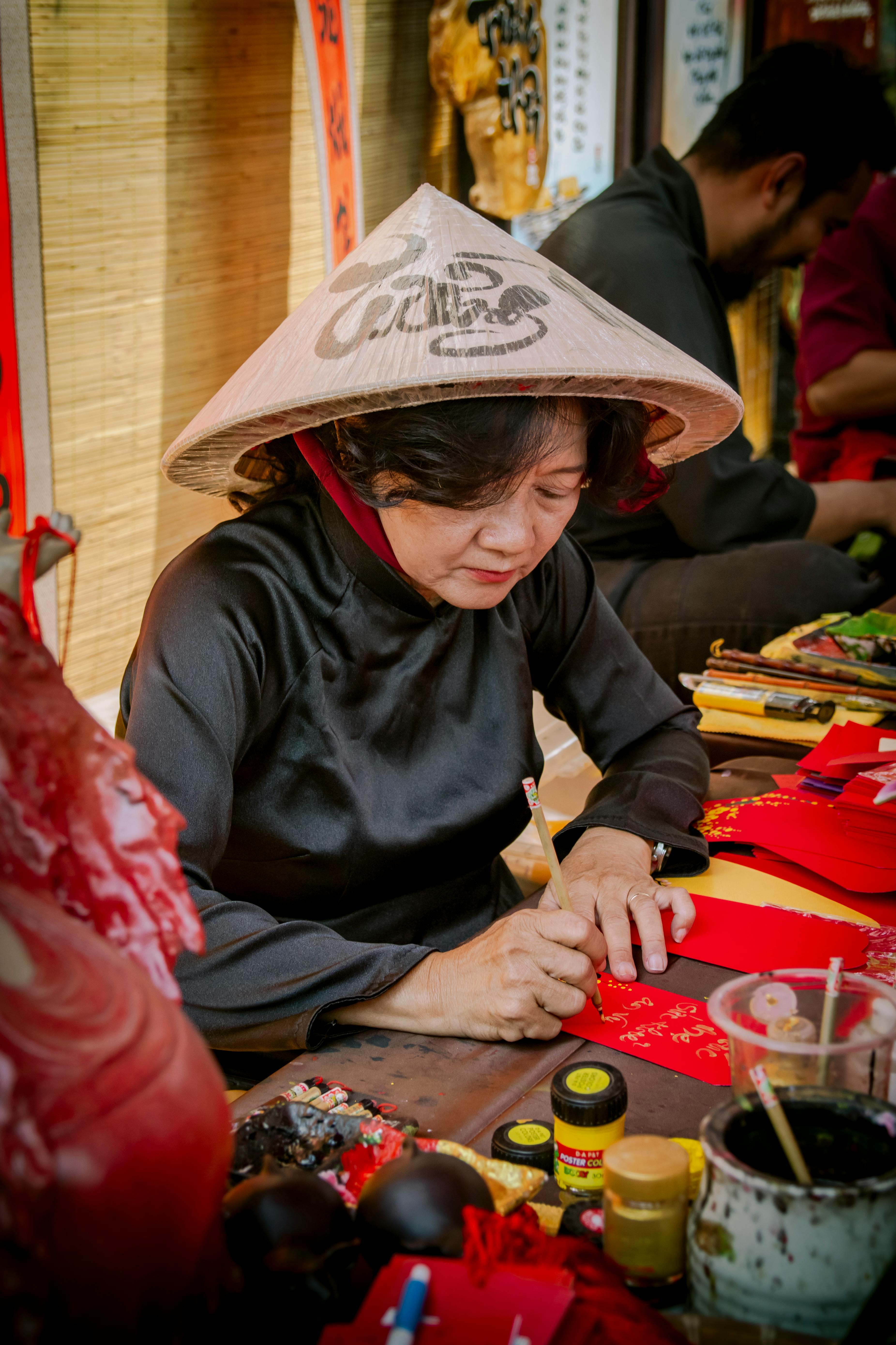 Woman Practicing Traditional Calligraphy Art · Free Stock Photo
