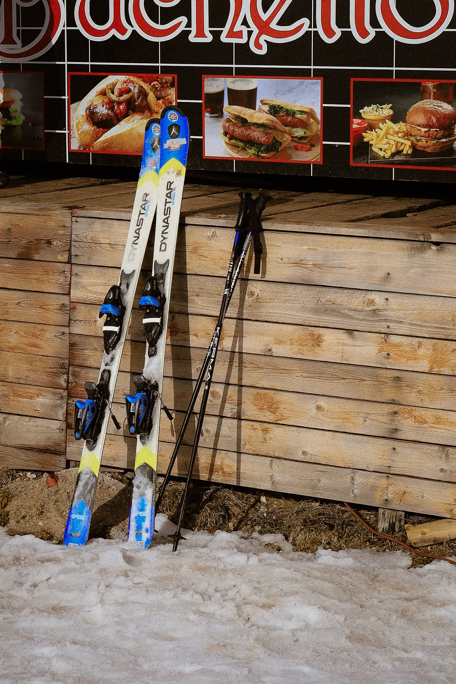 Ski Gear Leaning Against Rustic Ski Lodge Wall · Free Stock Photo