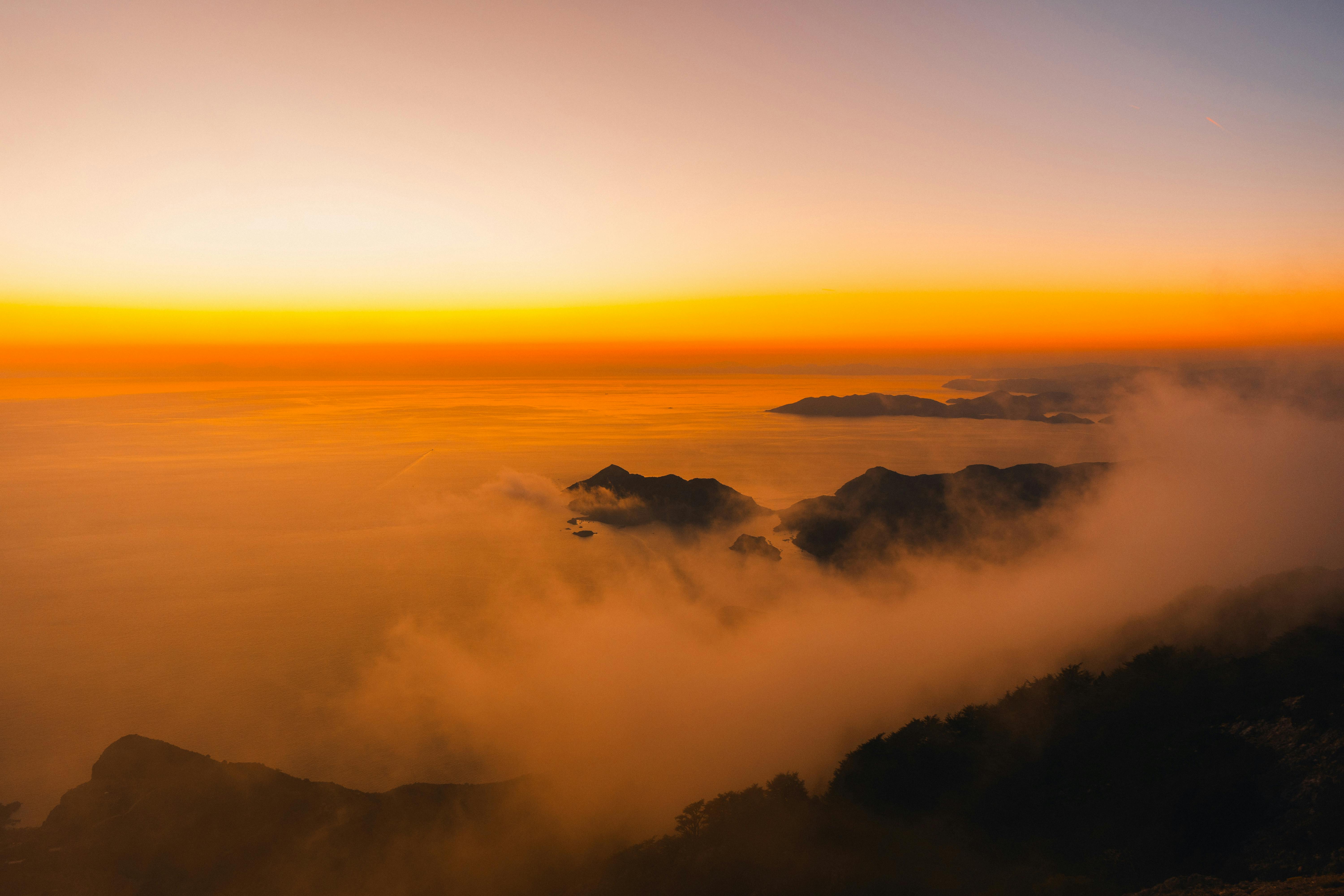 Sun Peaking Over Clouds · Free Stock Photo