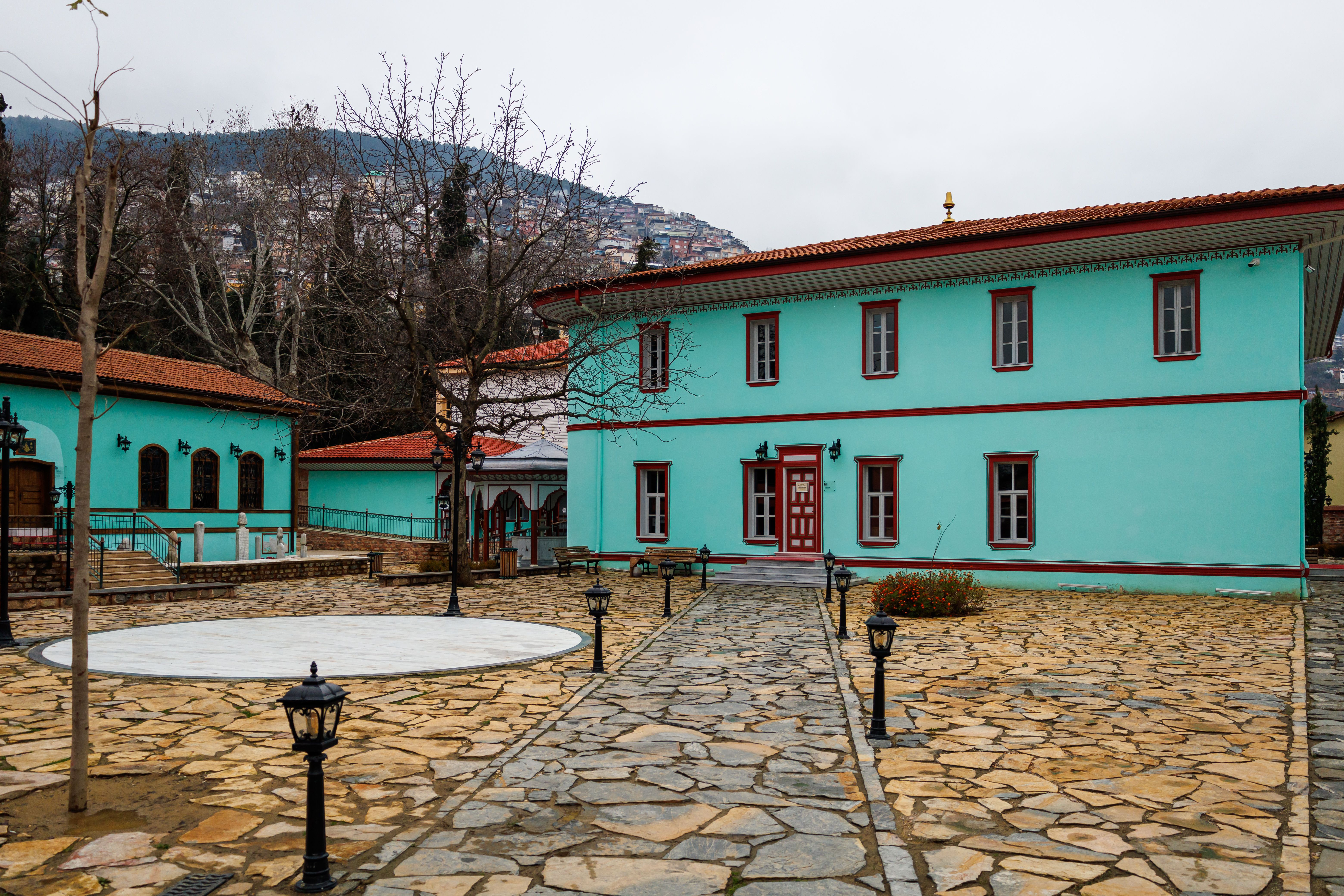 Traditional Turquoise House in Scenic Setting · Free Stock Photo