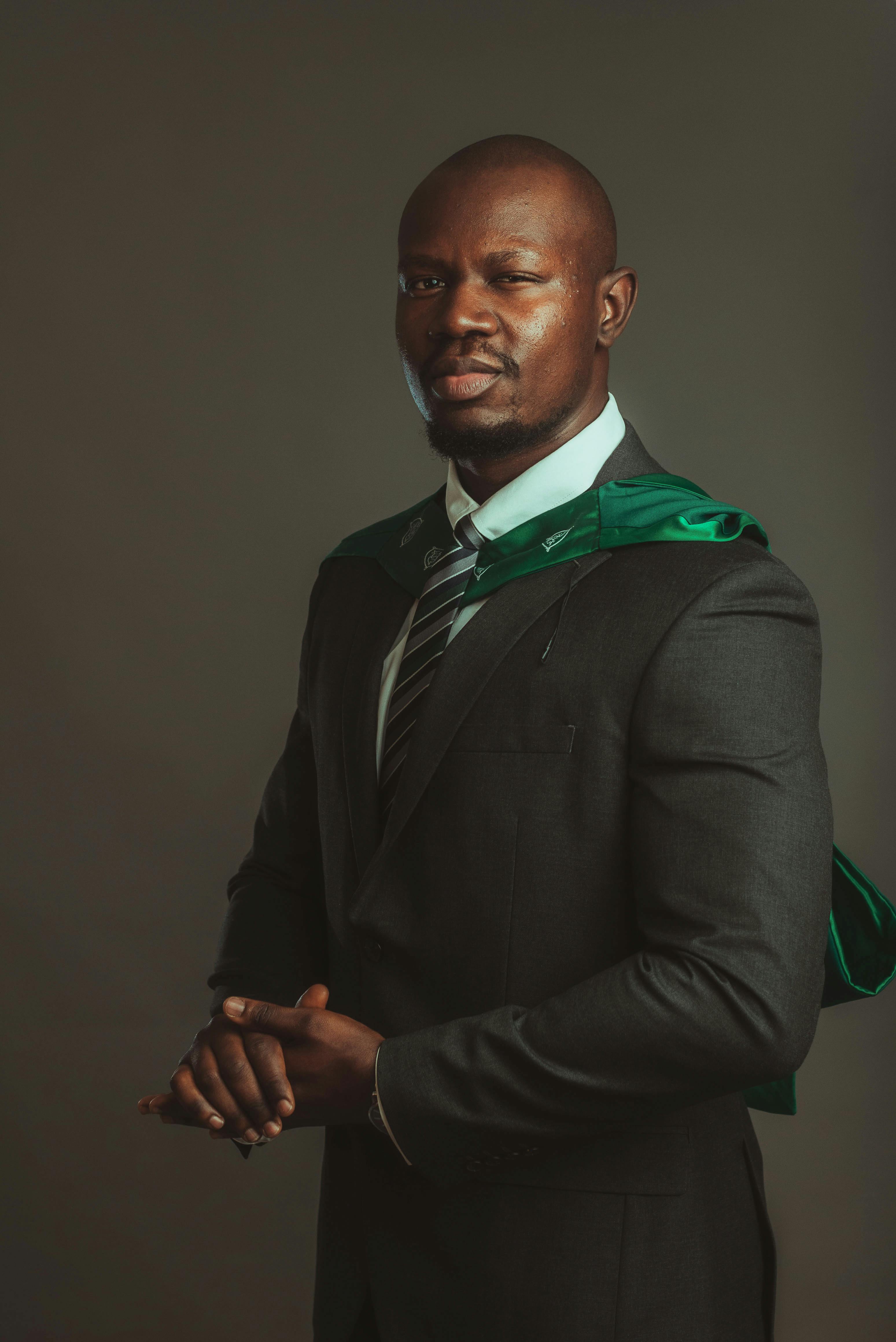 Dignified Portrait of a Graduate in Suit · Free Stock Photo