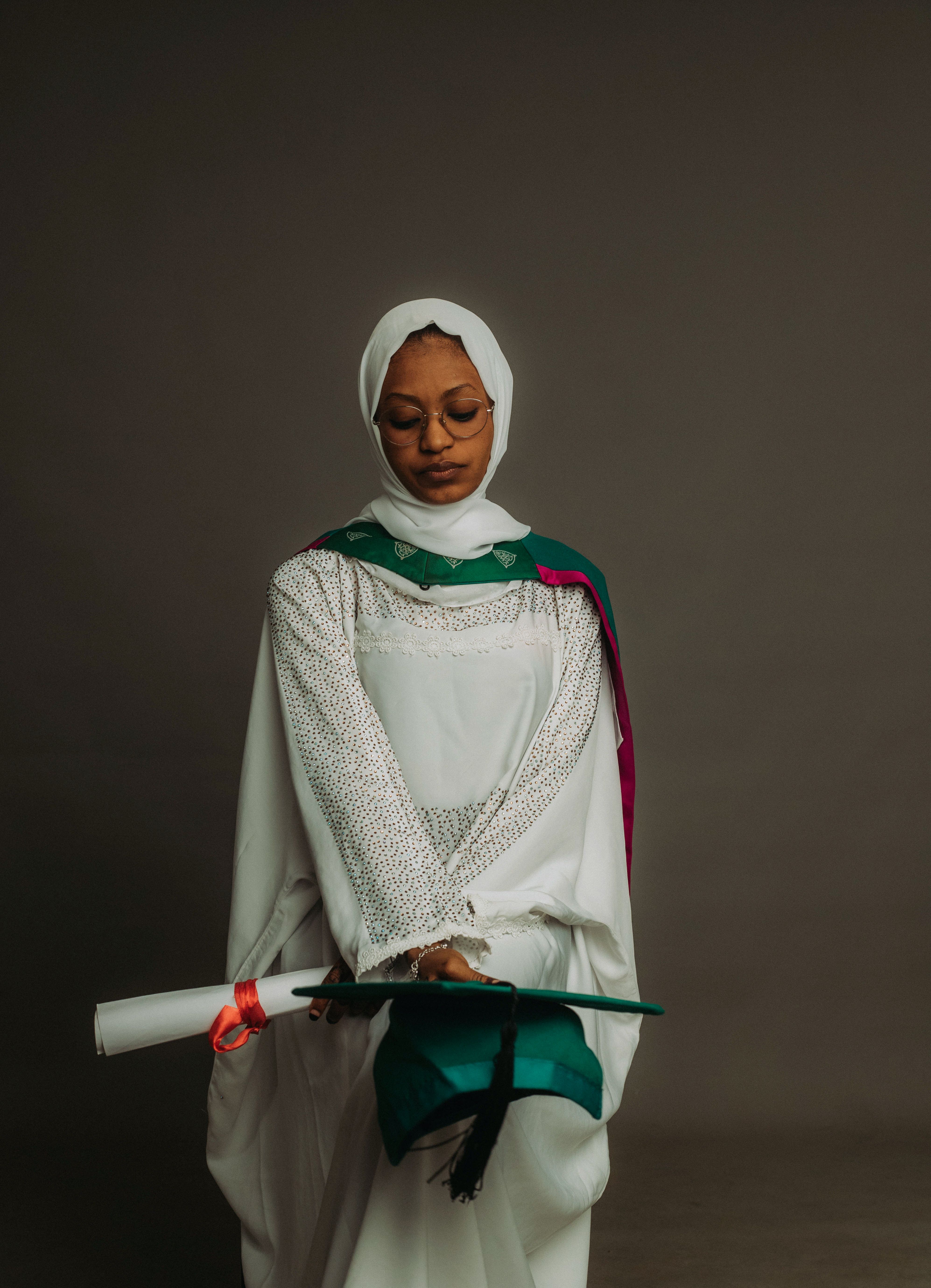 Portrait of Female Graduate in Traditional Attire · Free Stock Photo