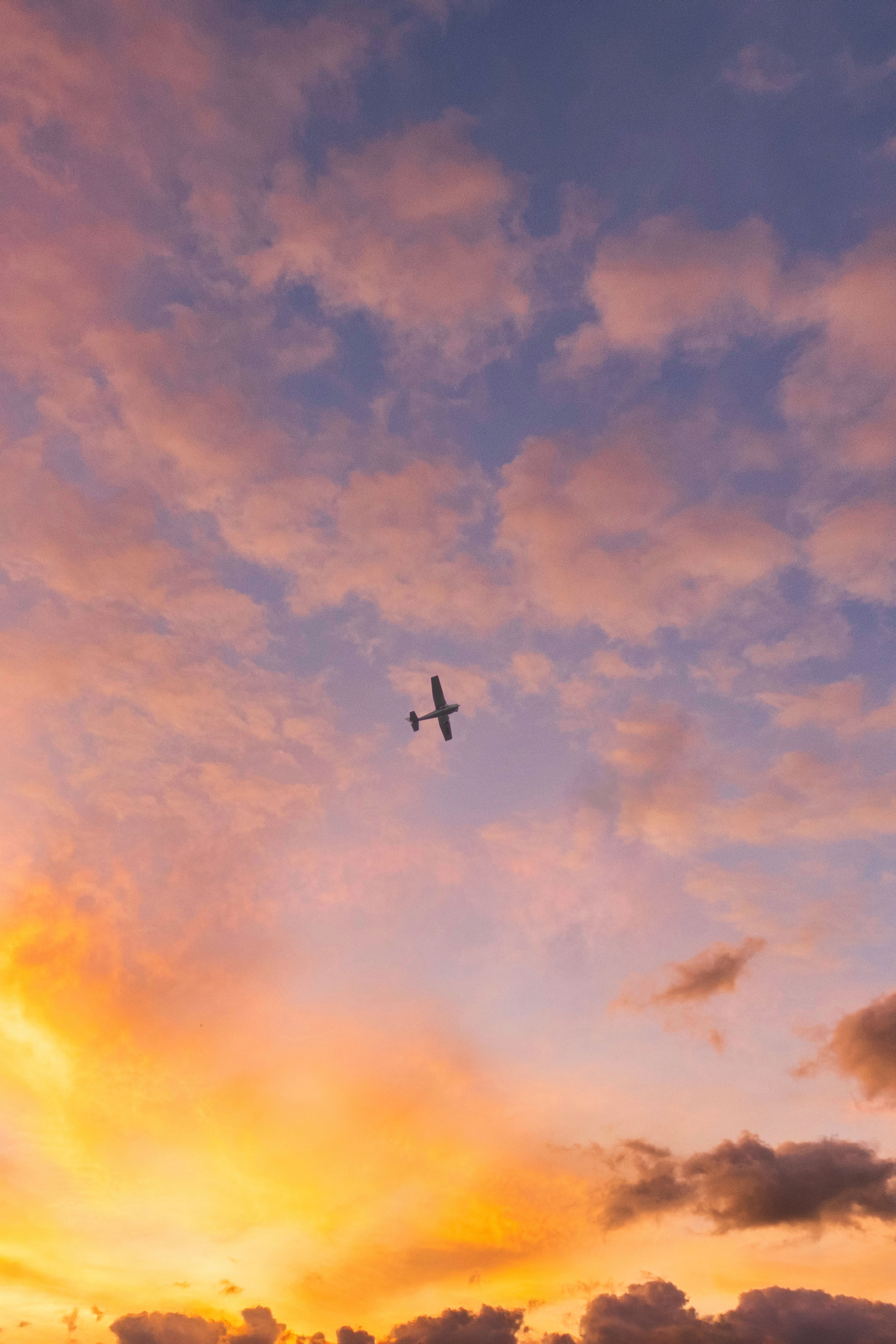 Small Airplane in Vivid Sunset Sky · Free Stock Photo