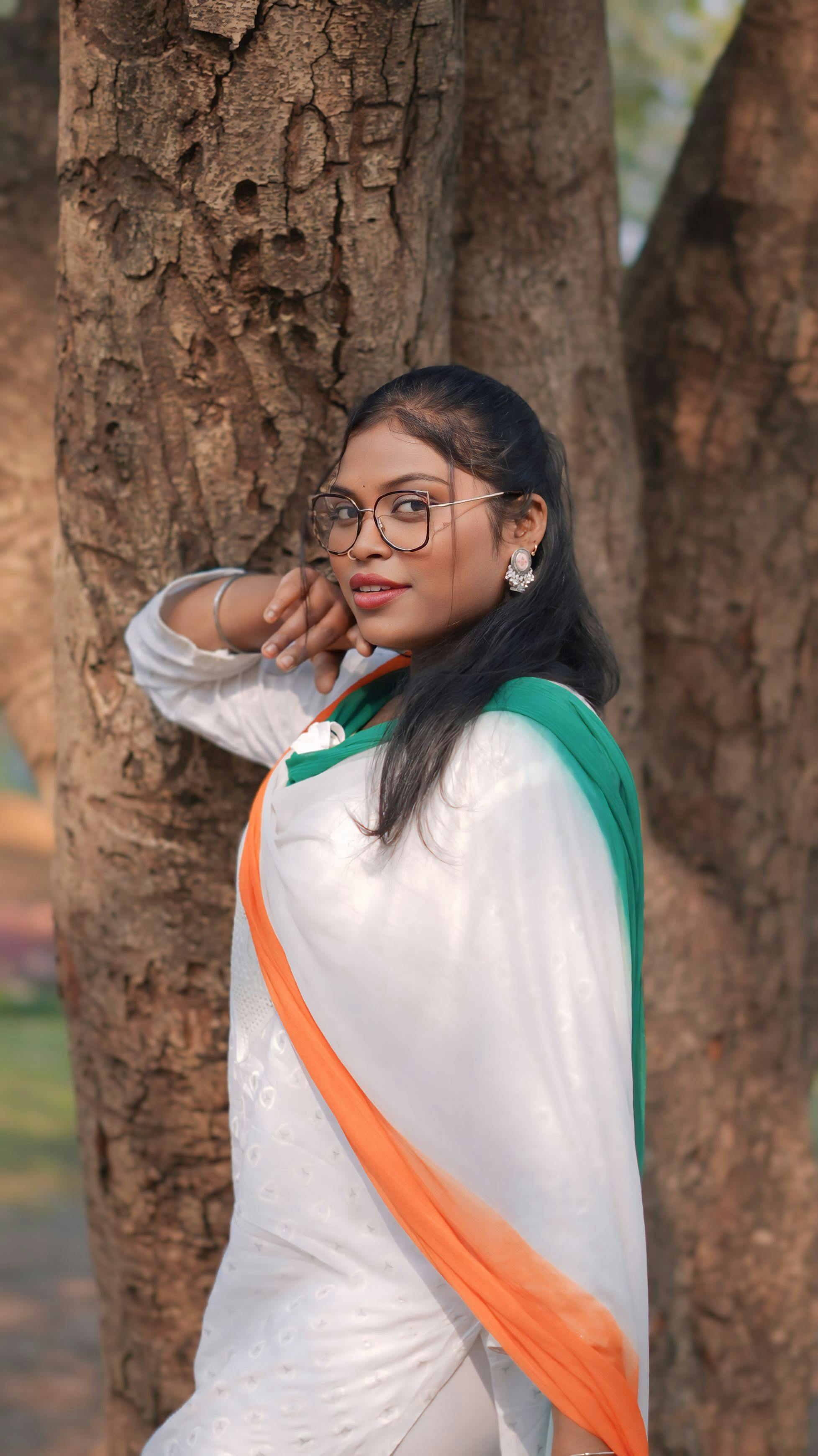 Young Woman in Tricolor Attire Posing Outdoors · Free Stock Photo