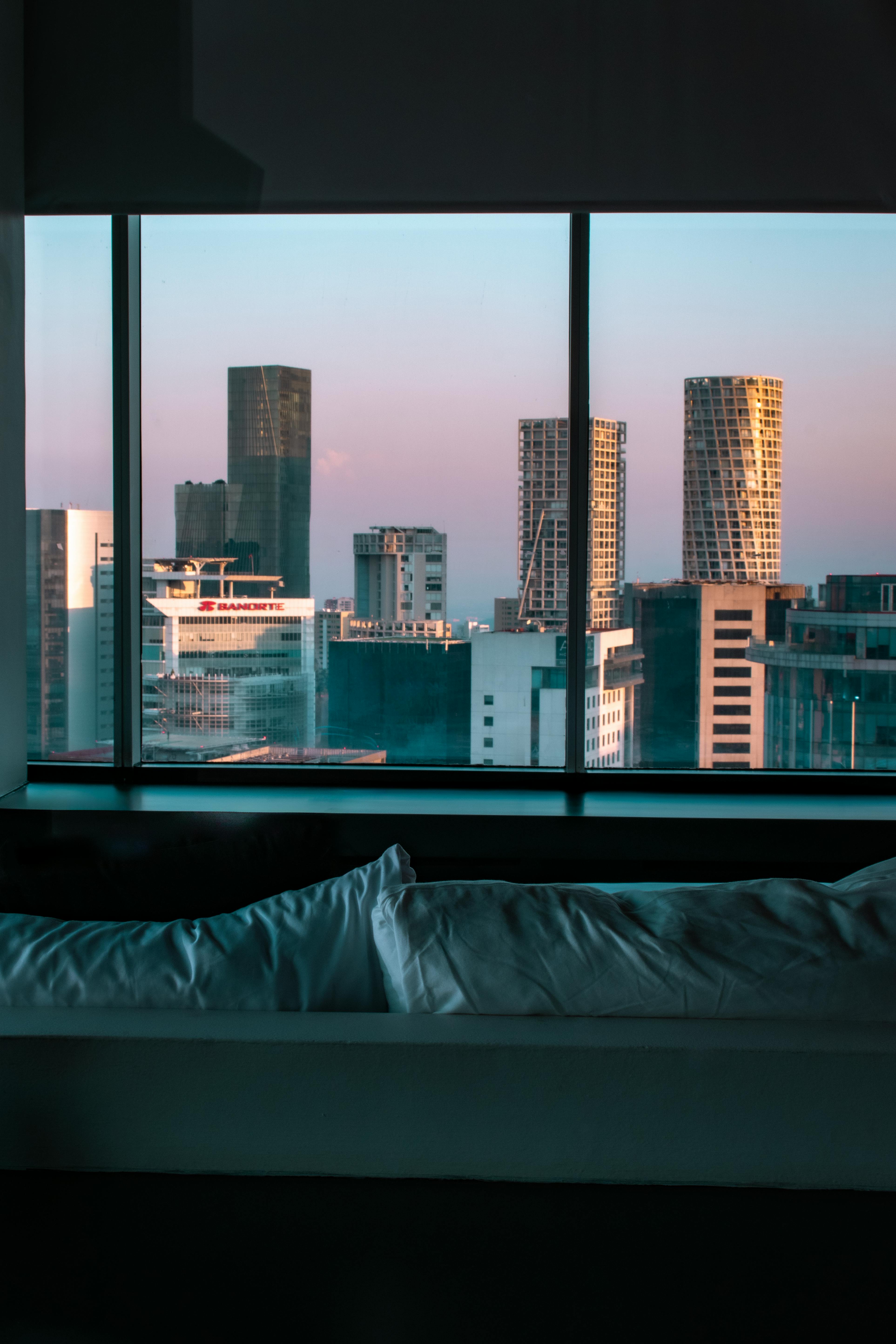 Urban Window View Framing Cityscape Skyline · Free Stock Photo