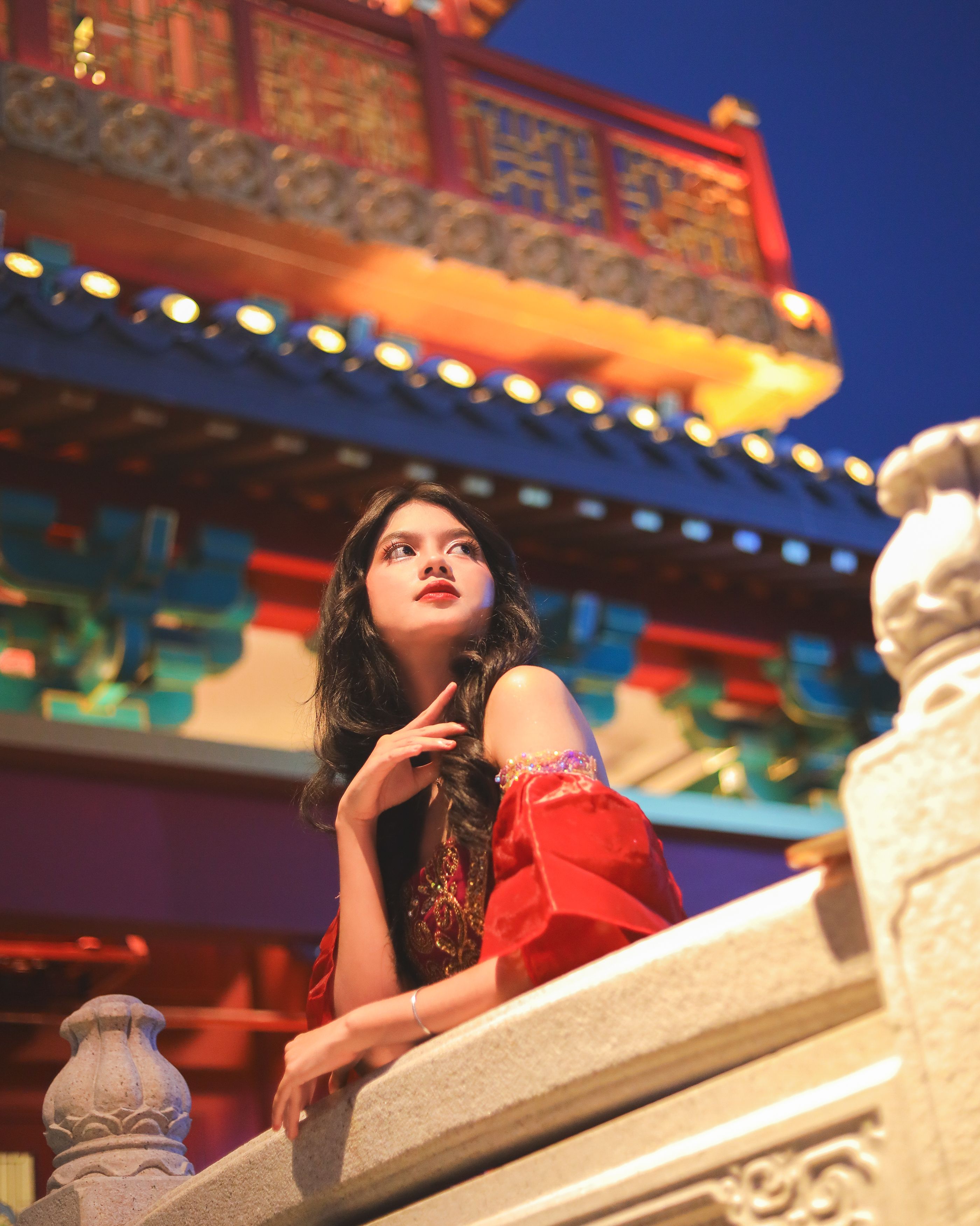 Young Woman in Traditional Dress at Night Market · Free Stock Photo