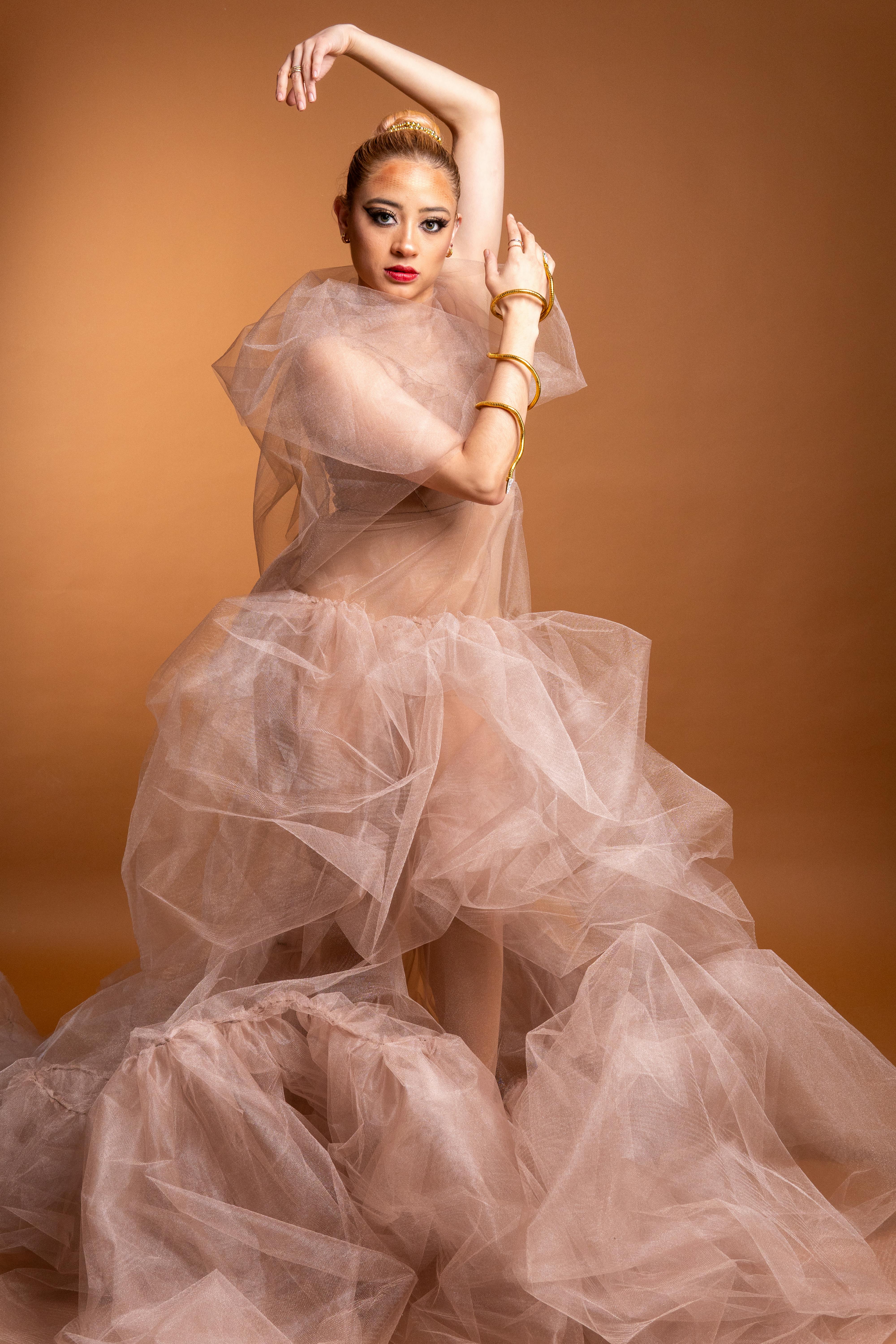 Elegant Artistic Dancer in Mocha Dress · Free Stock Photo