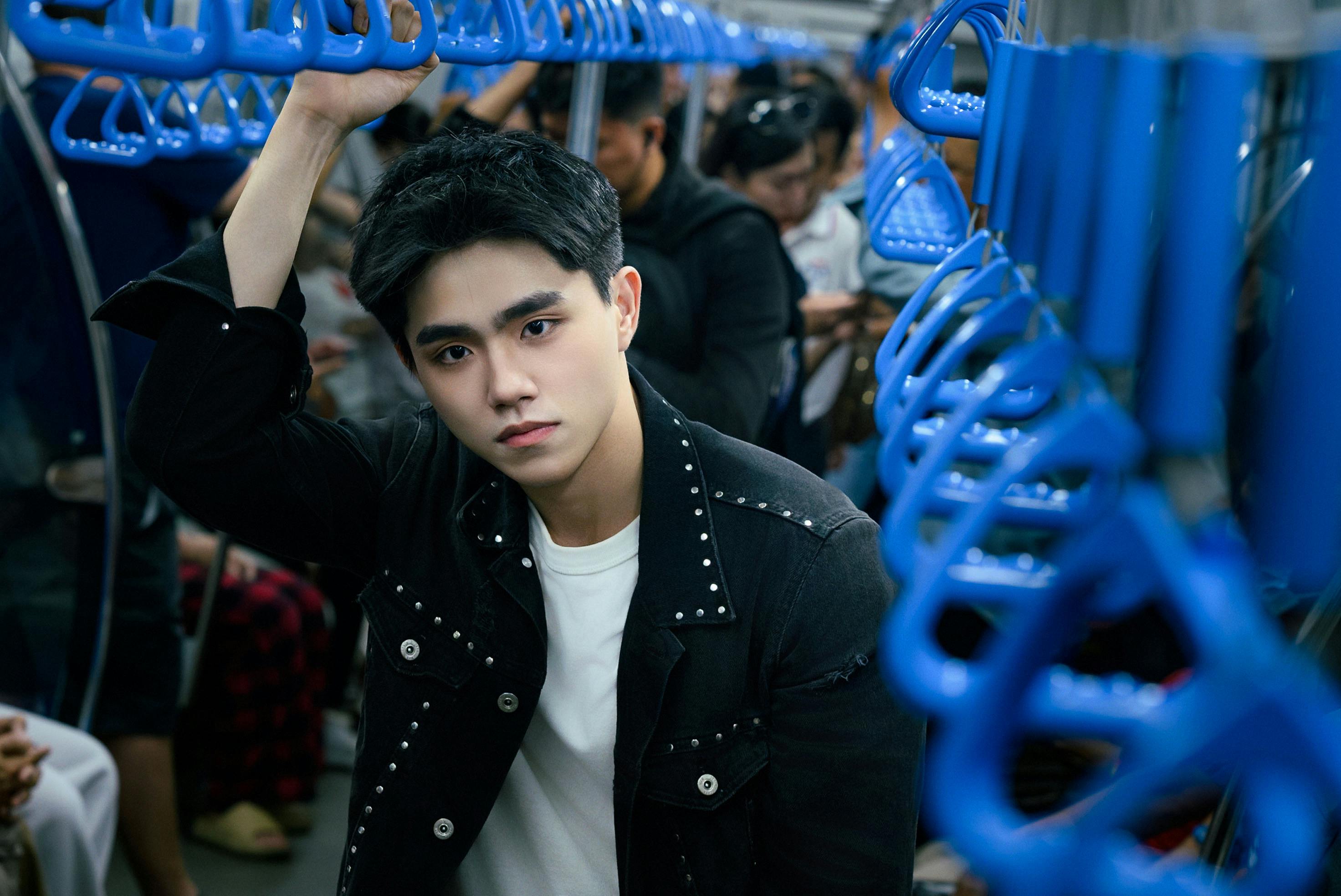 Young Man Riding Subway in Stylish Attire · Free Stock Photo