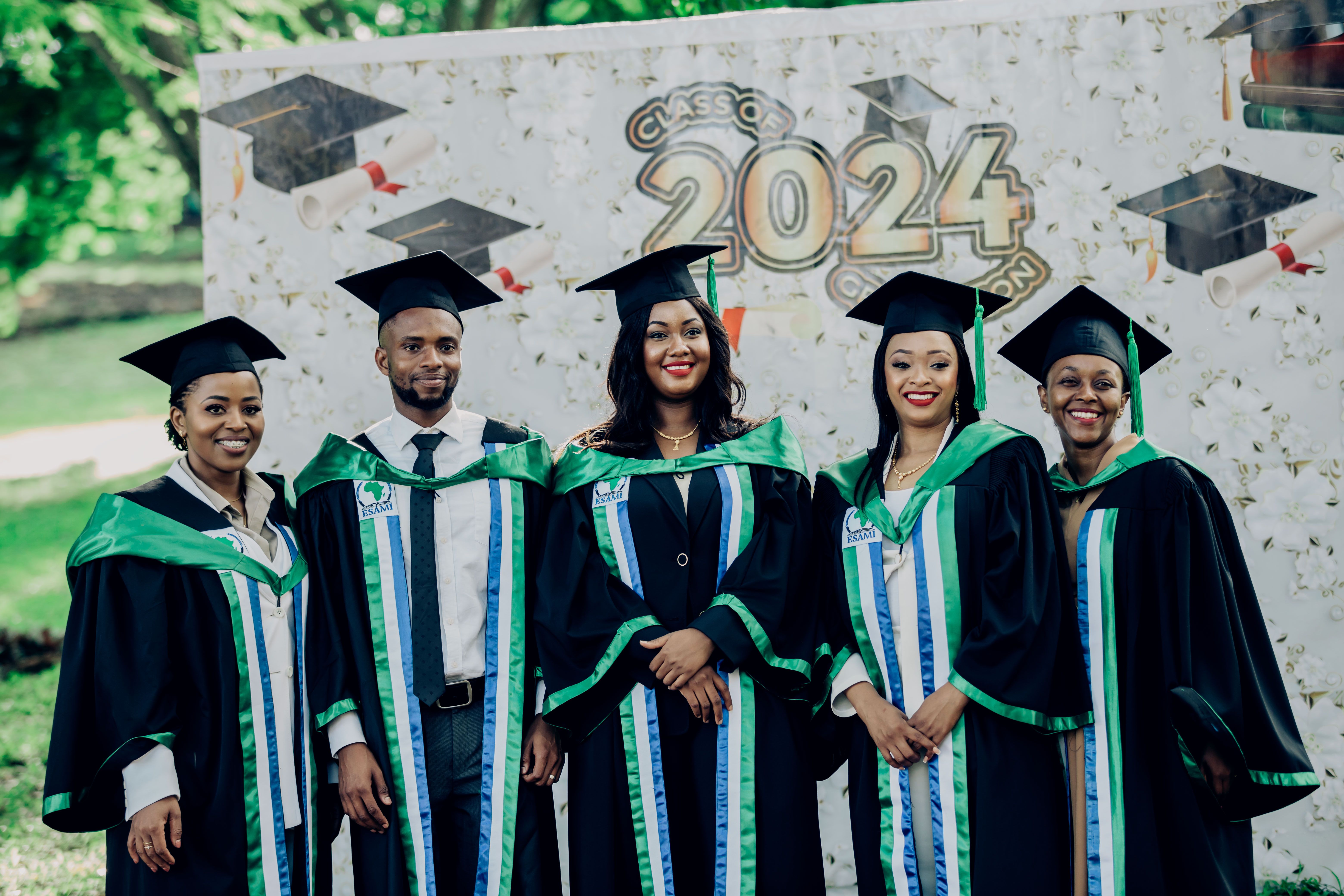 Group of Graduates Posing Outdoors in 2024 · Free Stock Photo