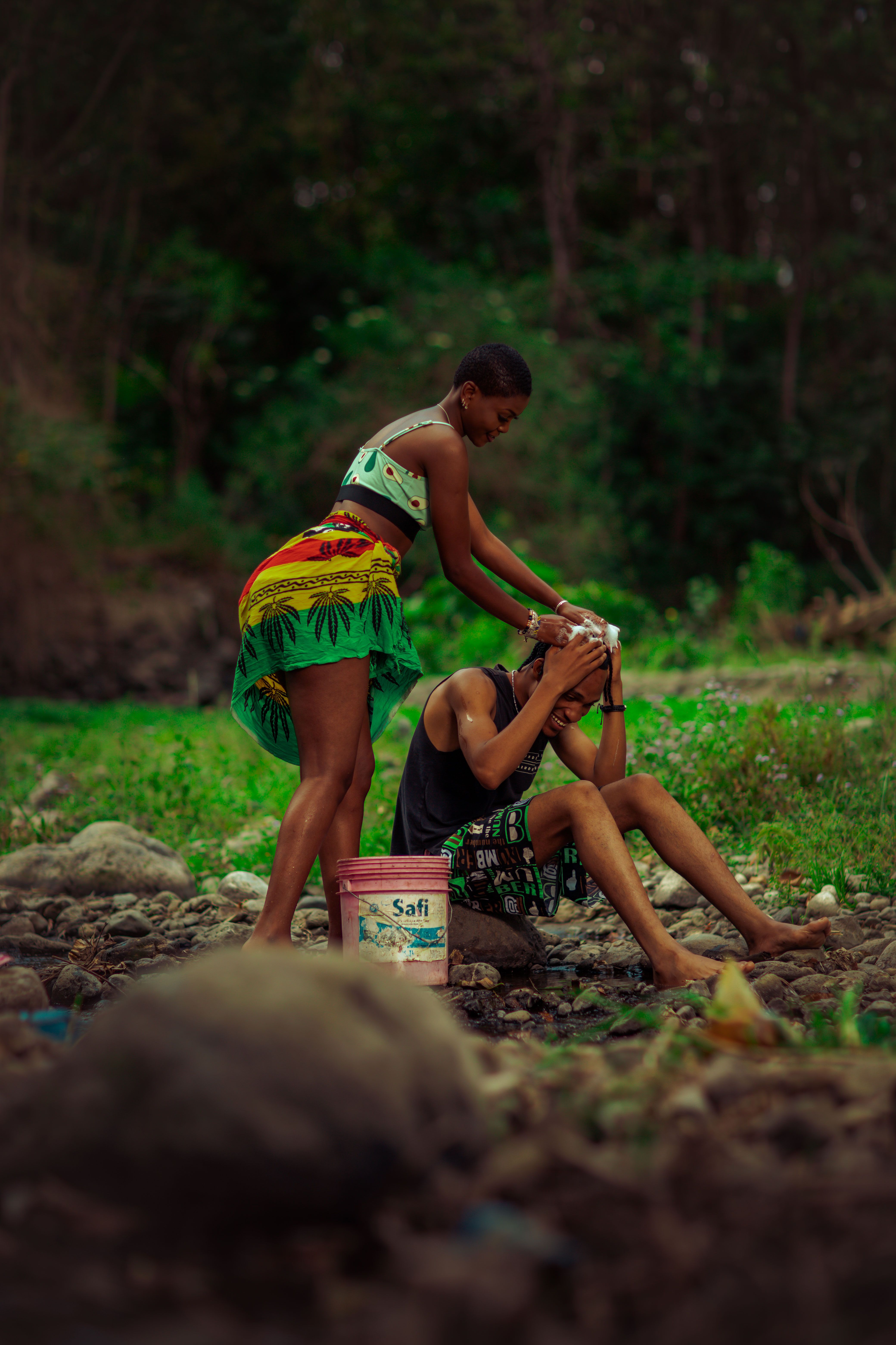 Traditional Outdoor Hair Washing in Nature · Free Stock Photo
