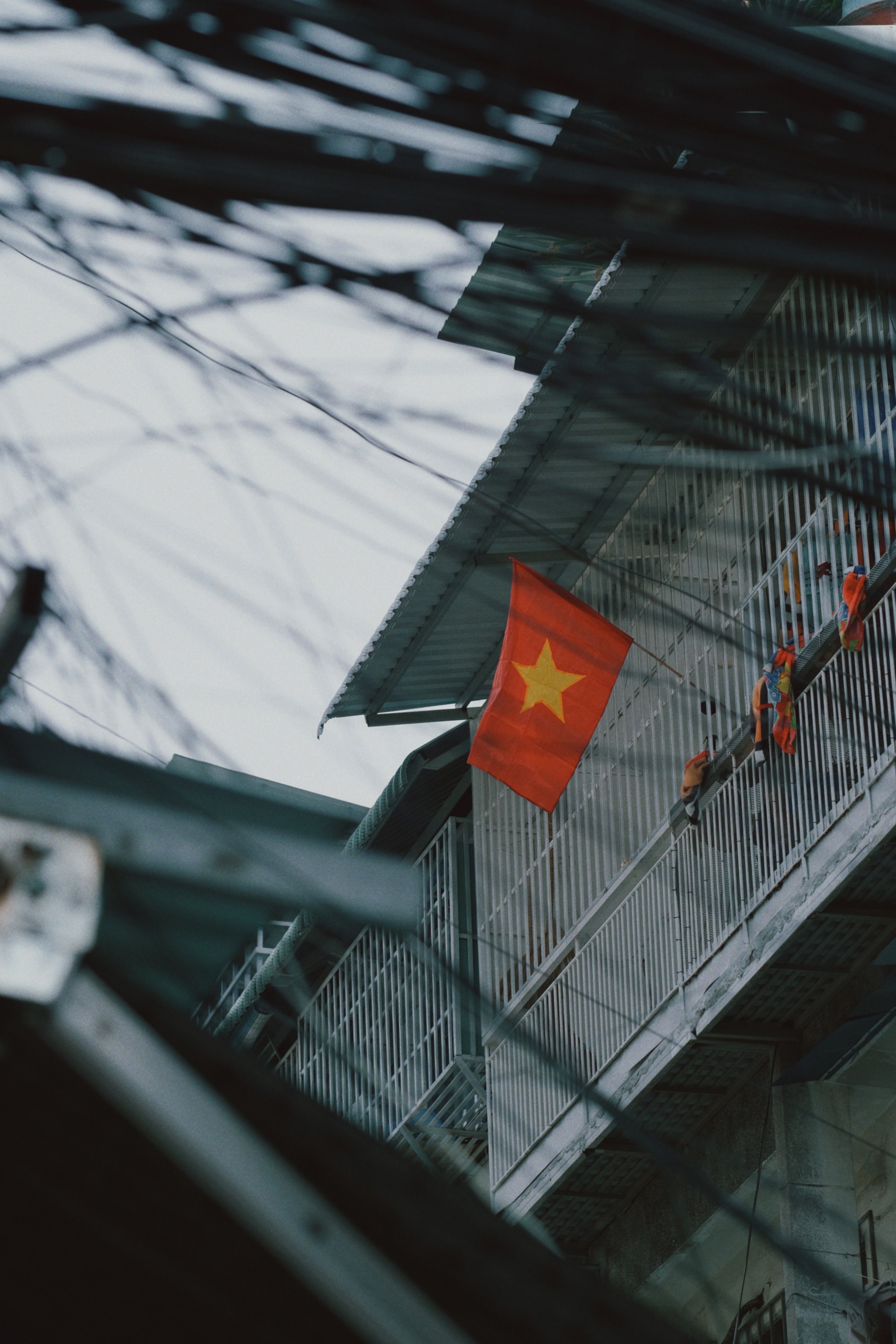 Vietnamese Flag on Urban Balcony · Free Stock Photo