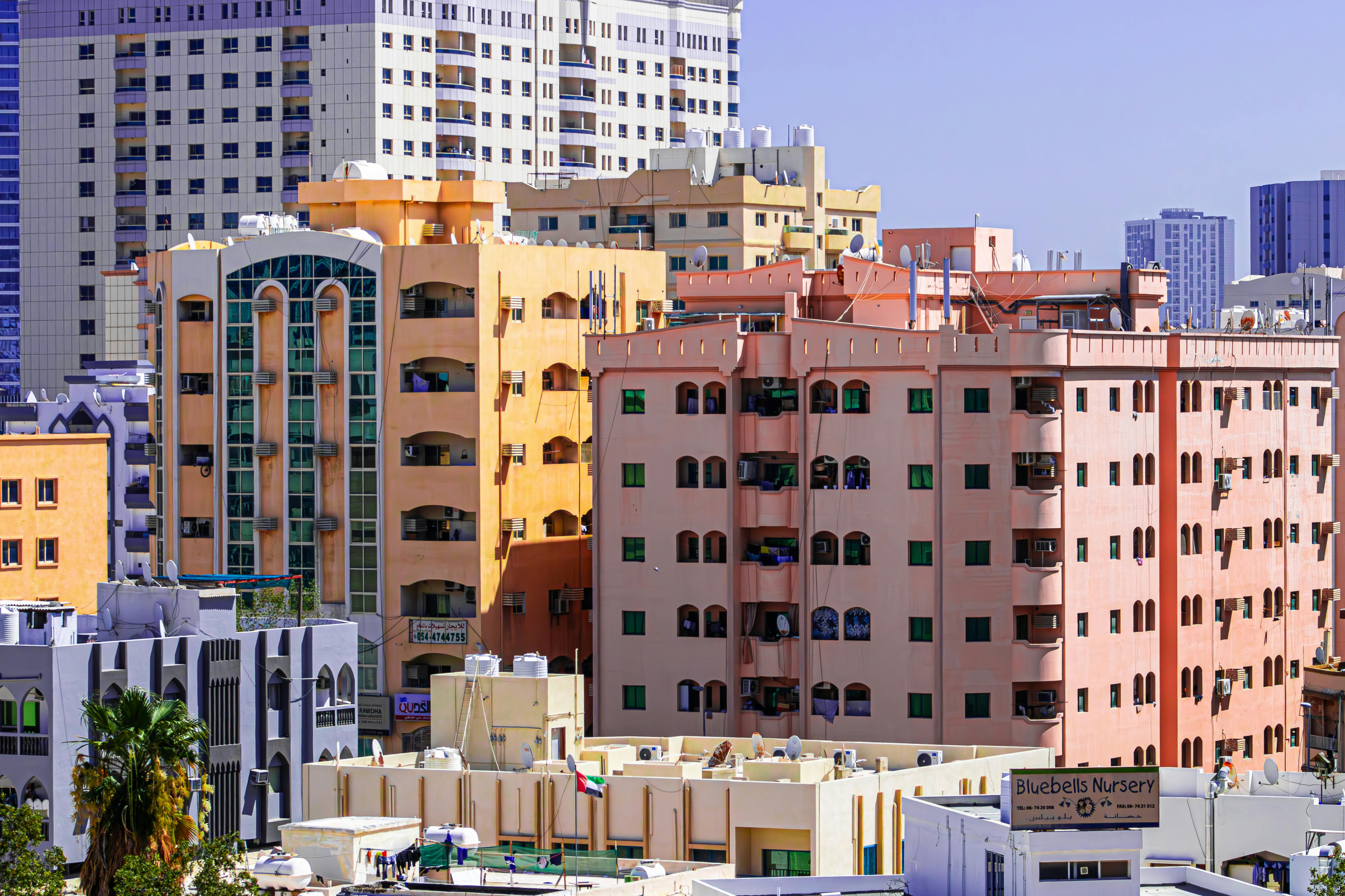 Colorful Residential Buildings in Ajman Cityscape · Free Stock Photo