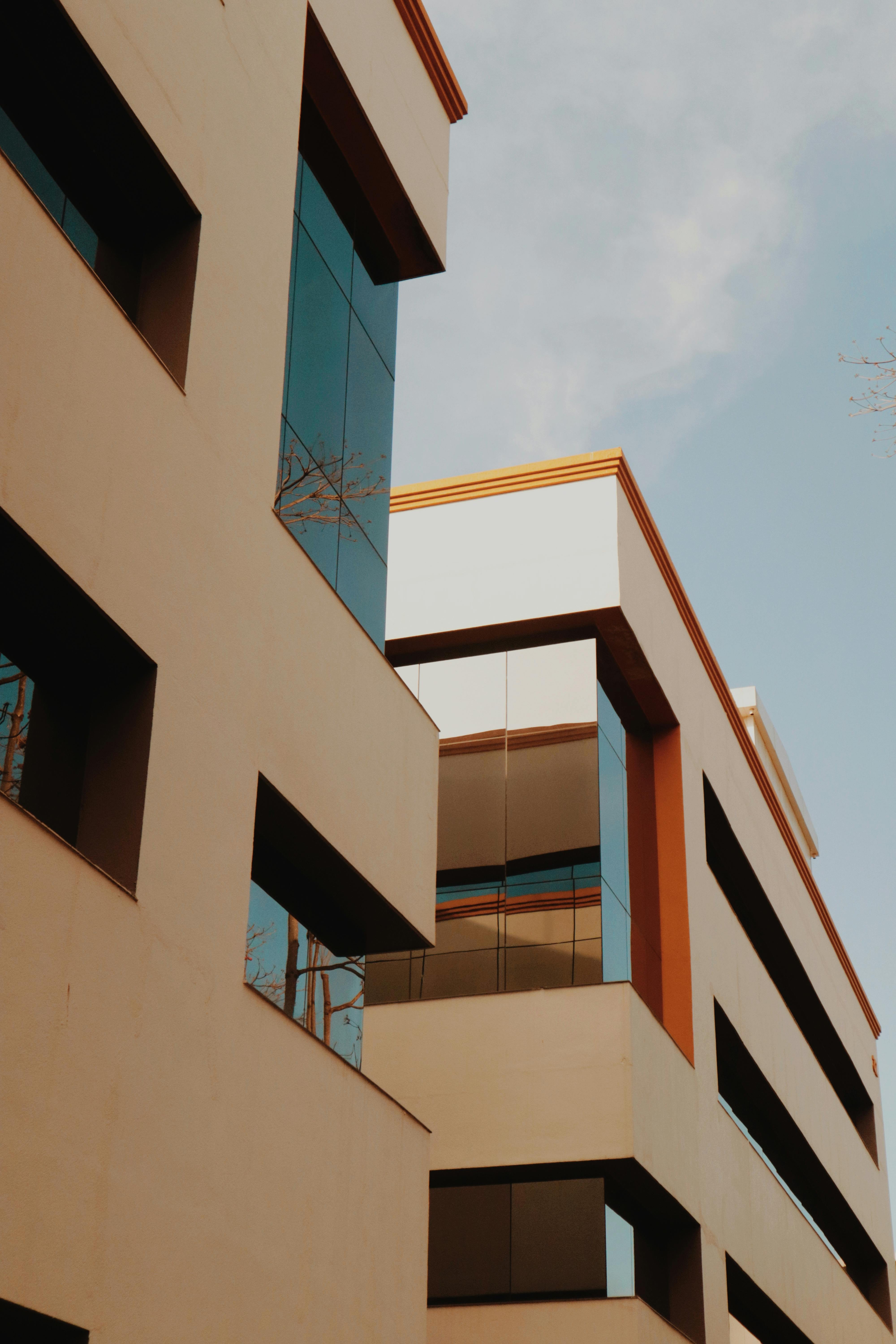 Modern Architectural Building with Blue Glass Windows · Free Stock Photo