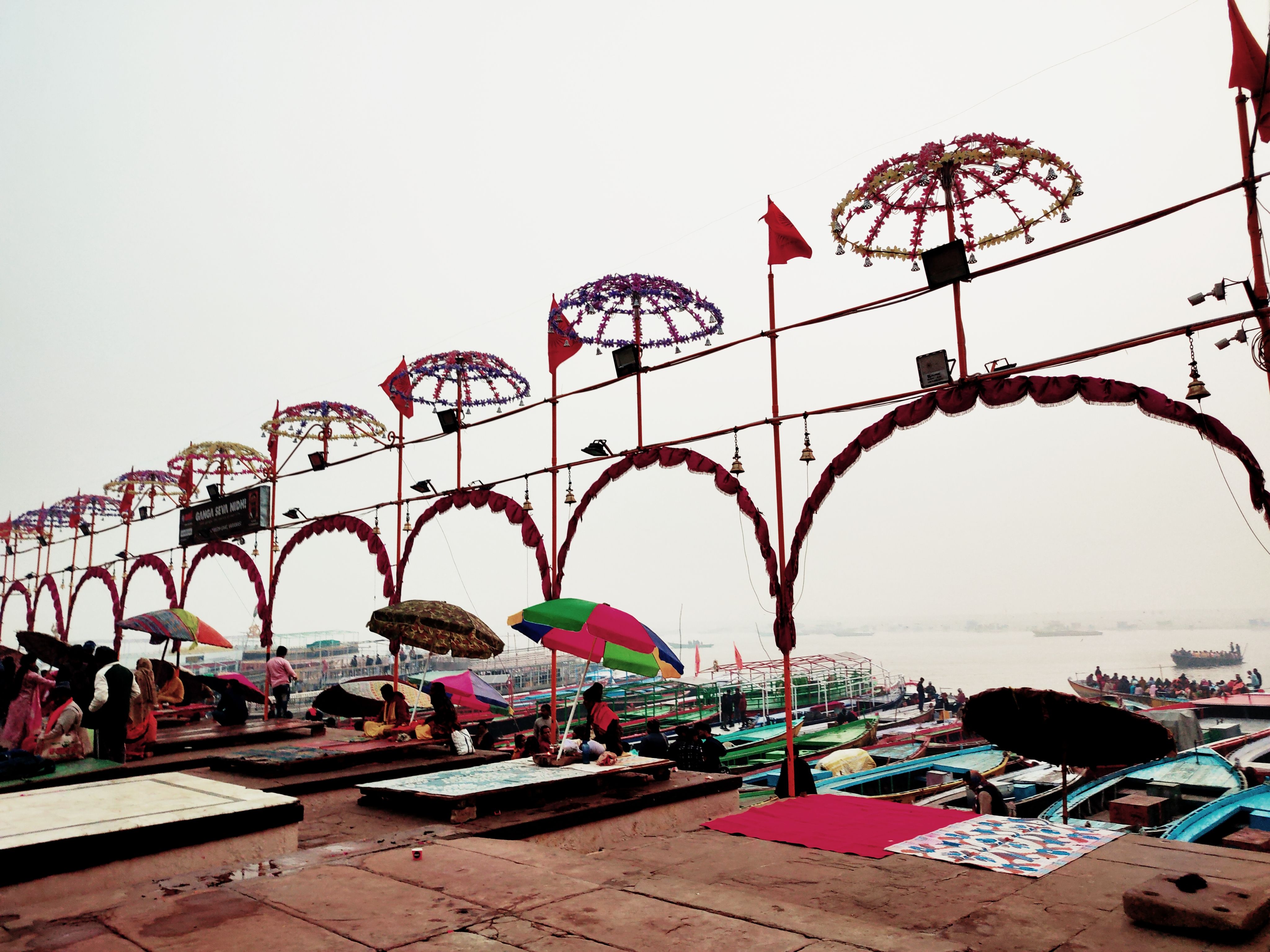 Colorful Boat Scene on Ganges Riverbank · Free Stock Photo