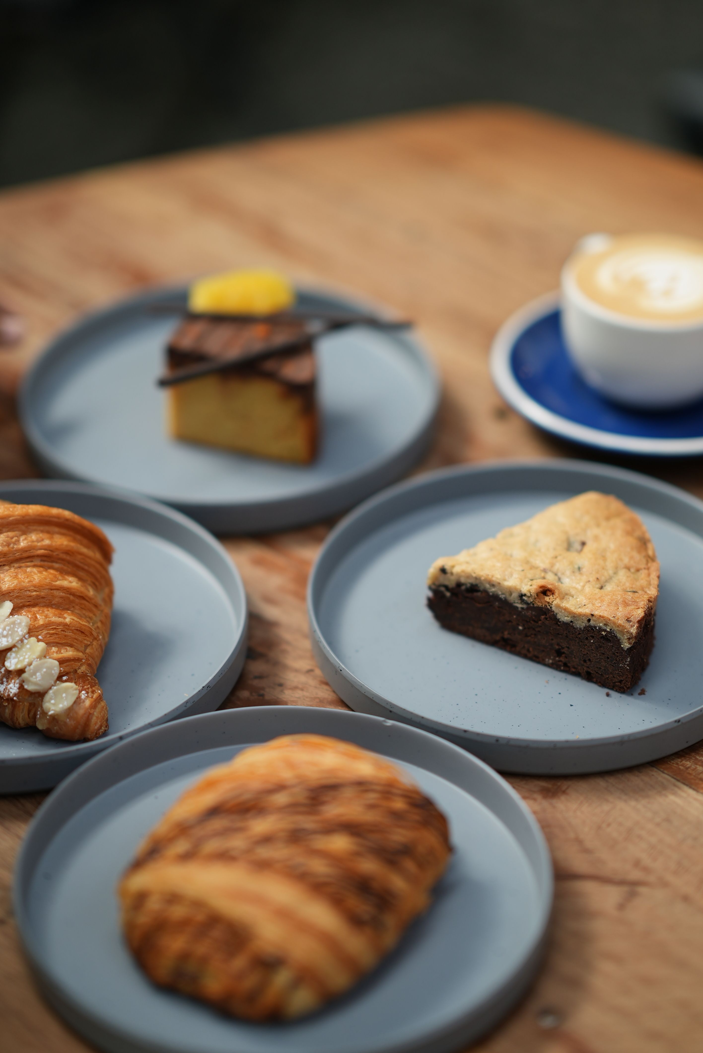Assorted Pastries on Plates with Coffee · Free Stock Photo