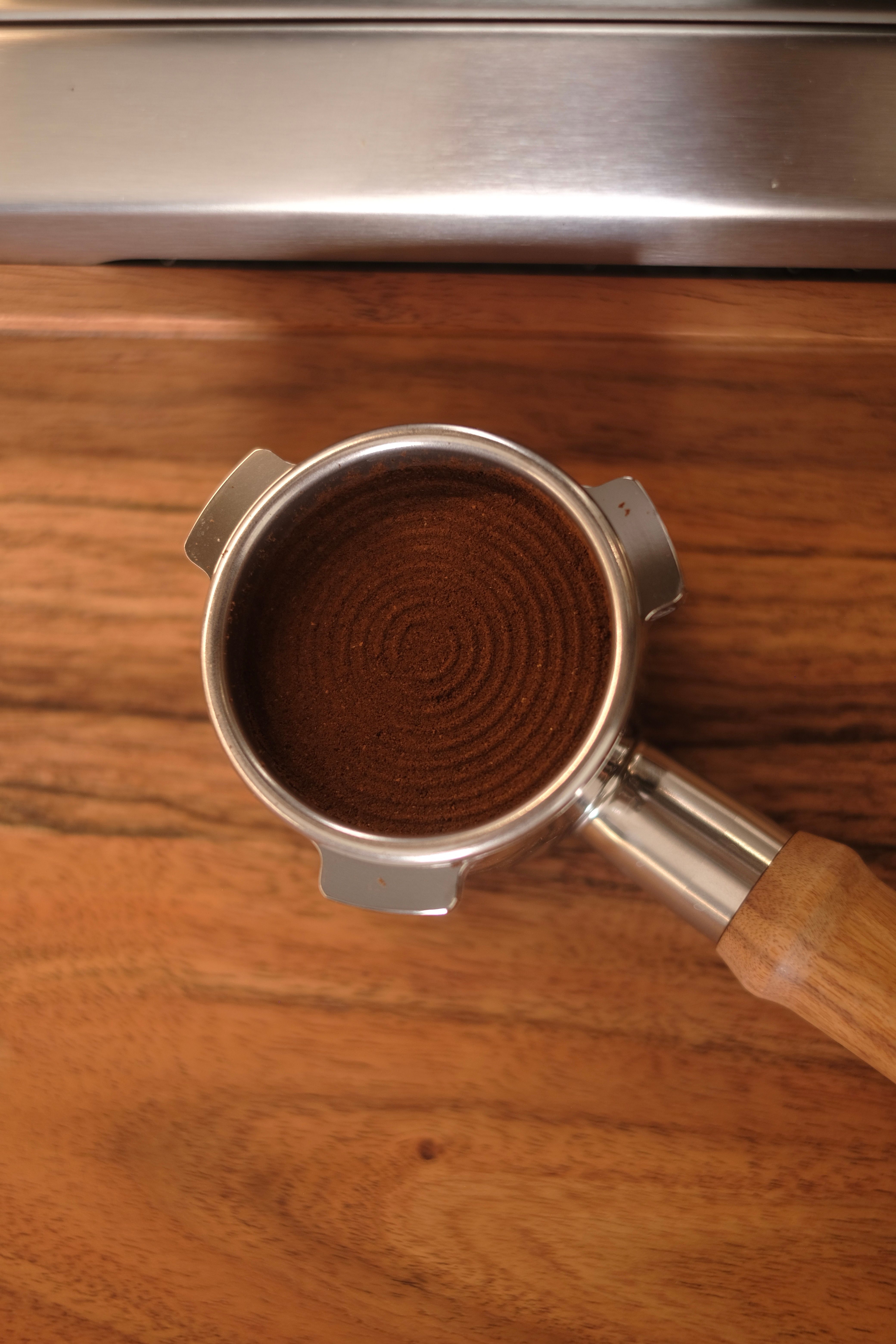 Close-up of coffee grounds in portafilter · Free Stock Photo