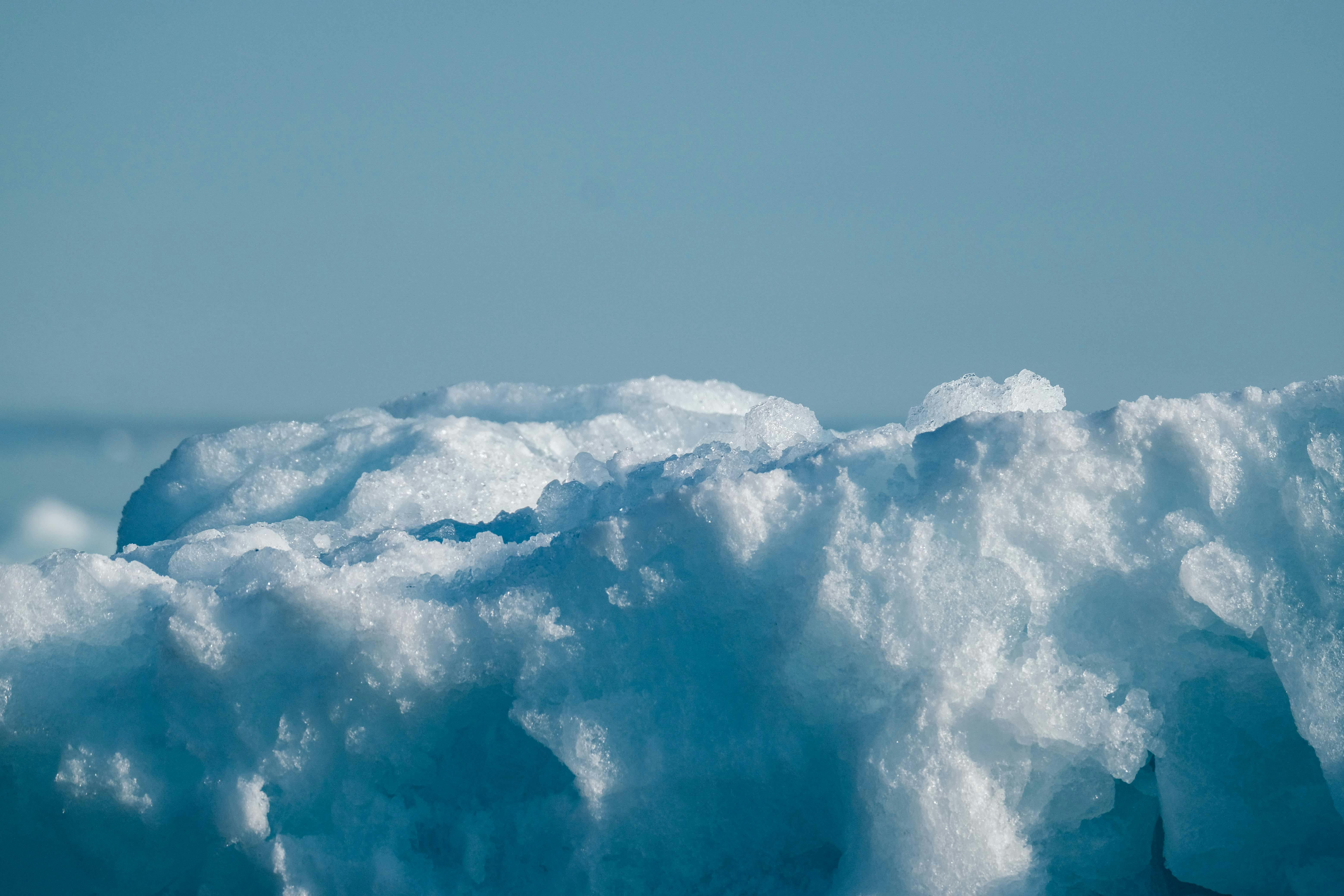 Majestic Frozen Iceberg in Sunlight · Free Stock Photo