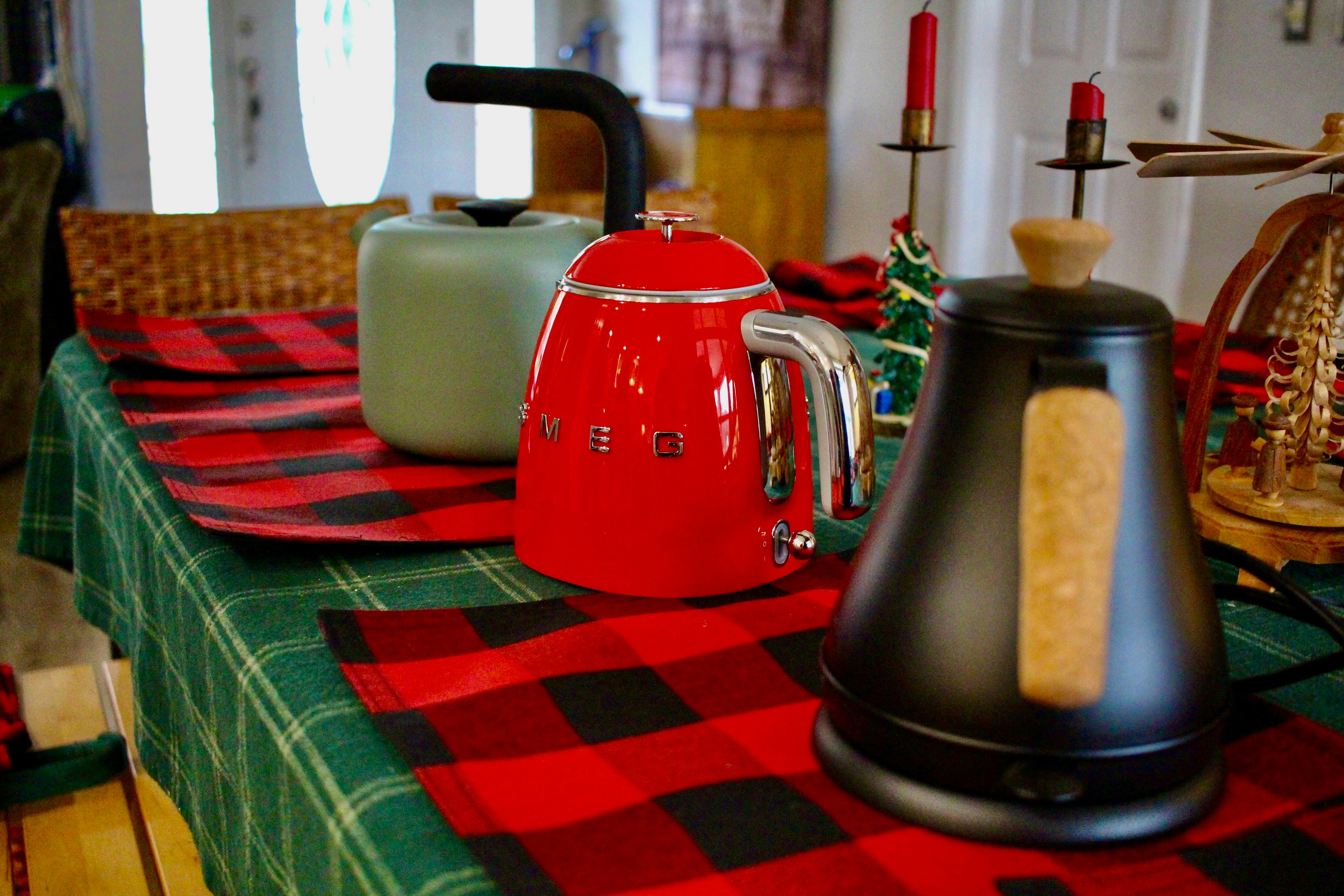 Festive Kitchen Table with Colorful Kettles · Free Stock Photo