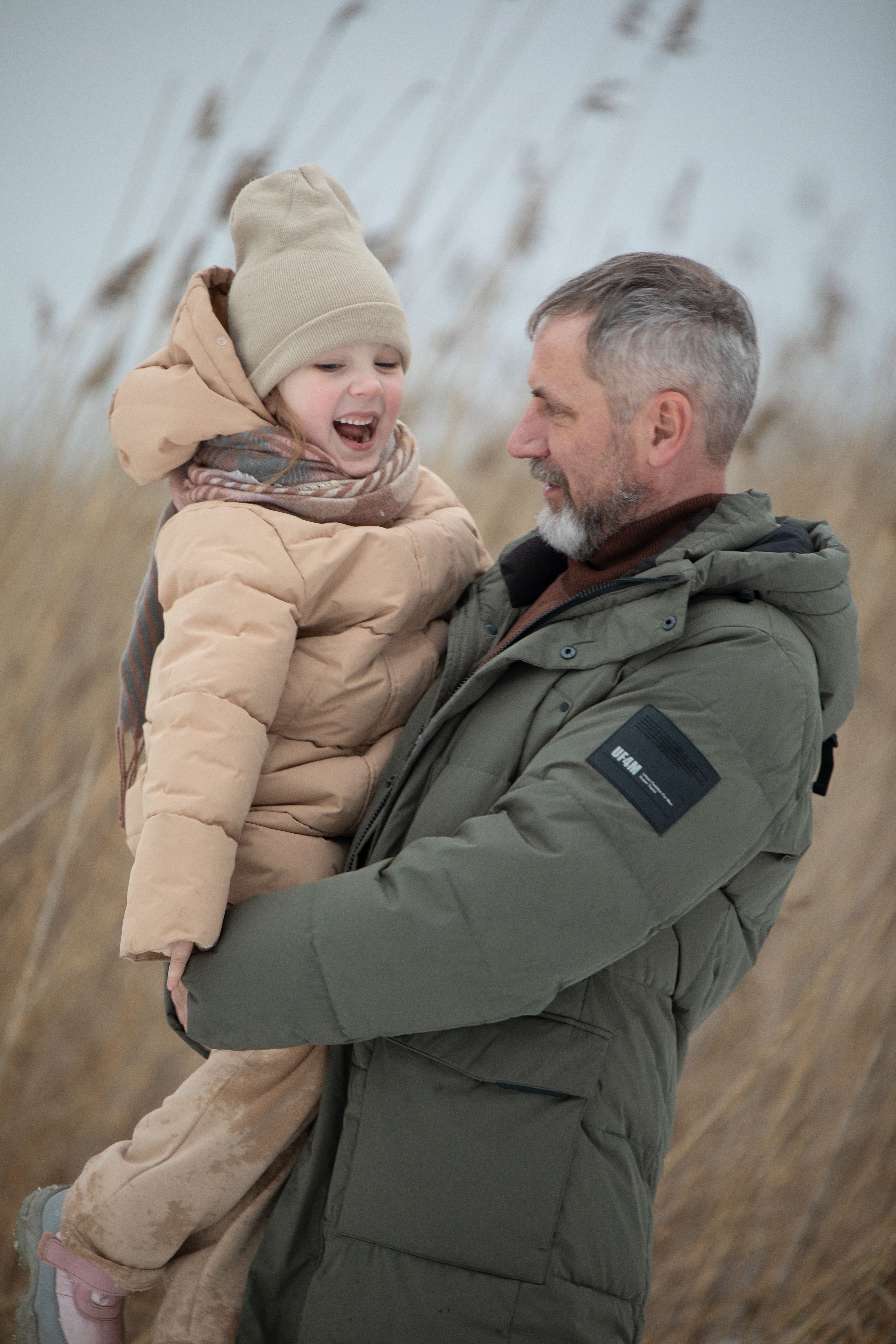 Father and Daughter Enjoying Winter Outdoors · Free Stock Photo