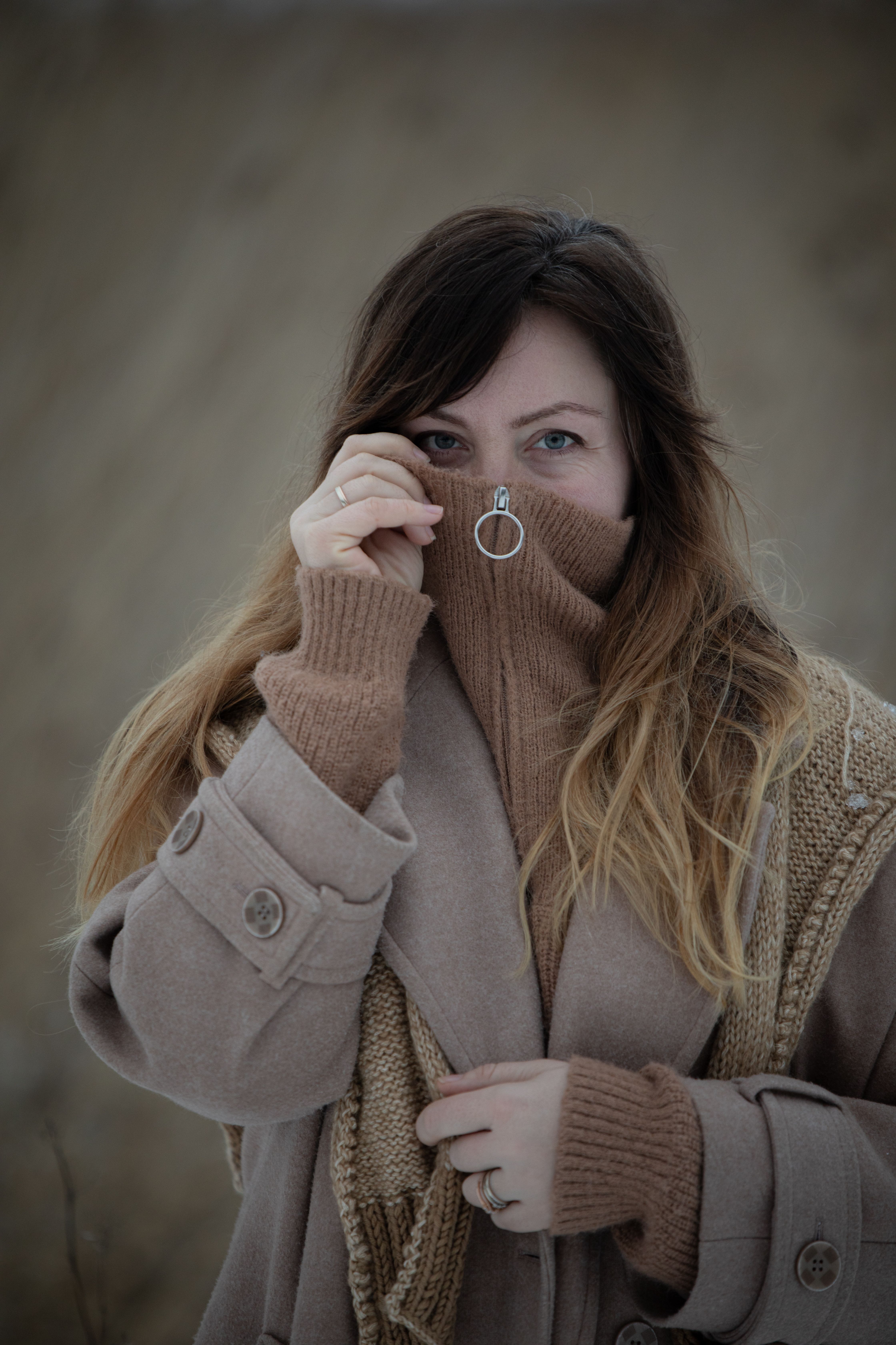 Woman in Winter Coat with Pulled-Up Collar · Free Stock Photo