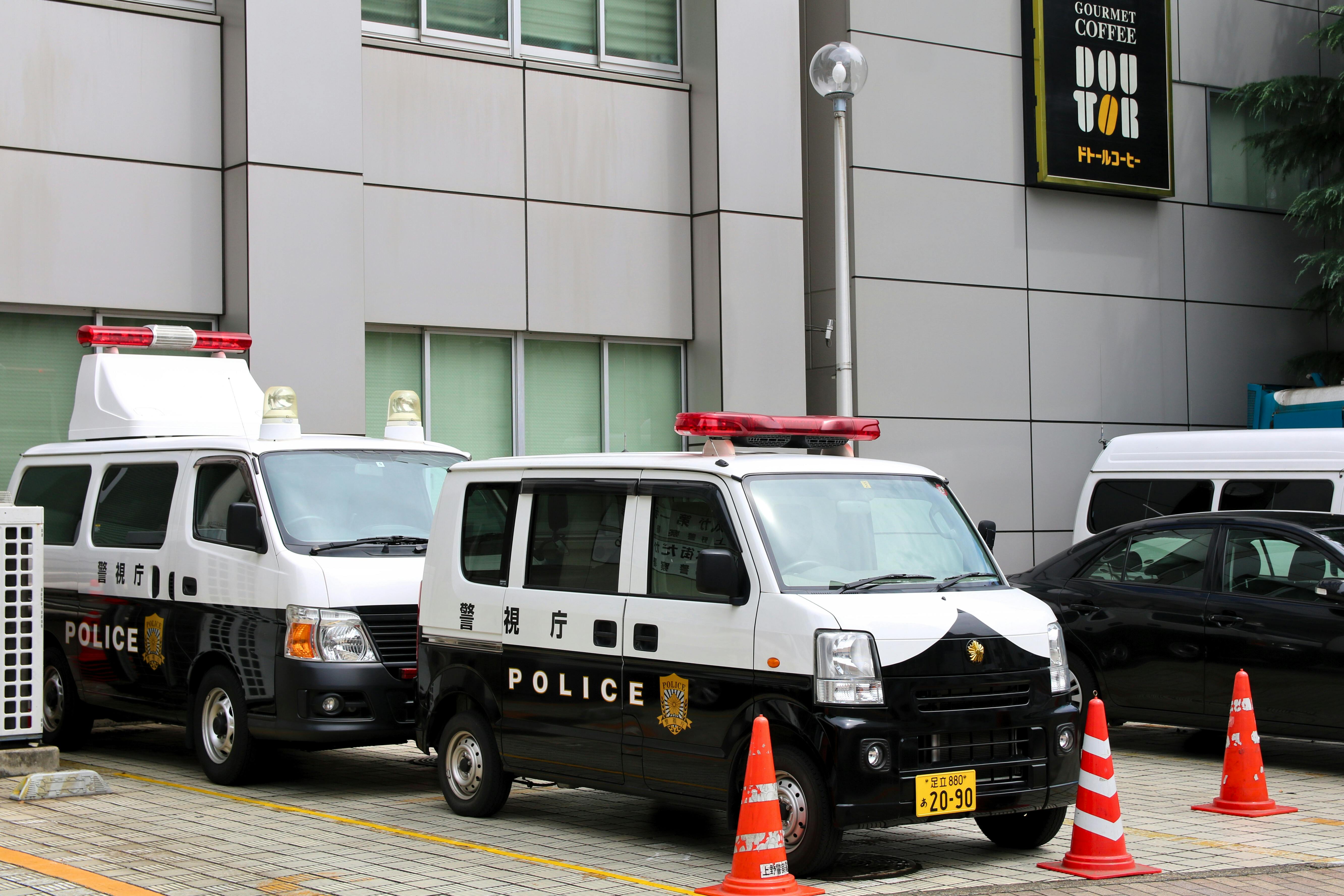 Japanese Police Vehicles in Tokyo Urban Scene · Free Stock Photo