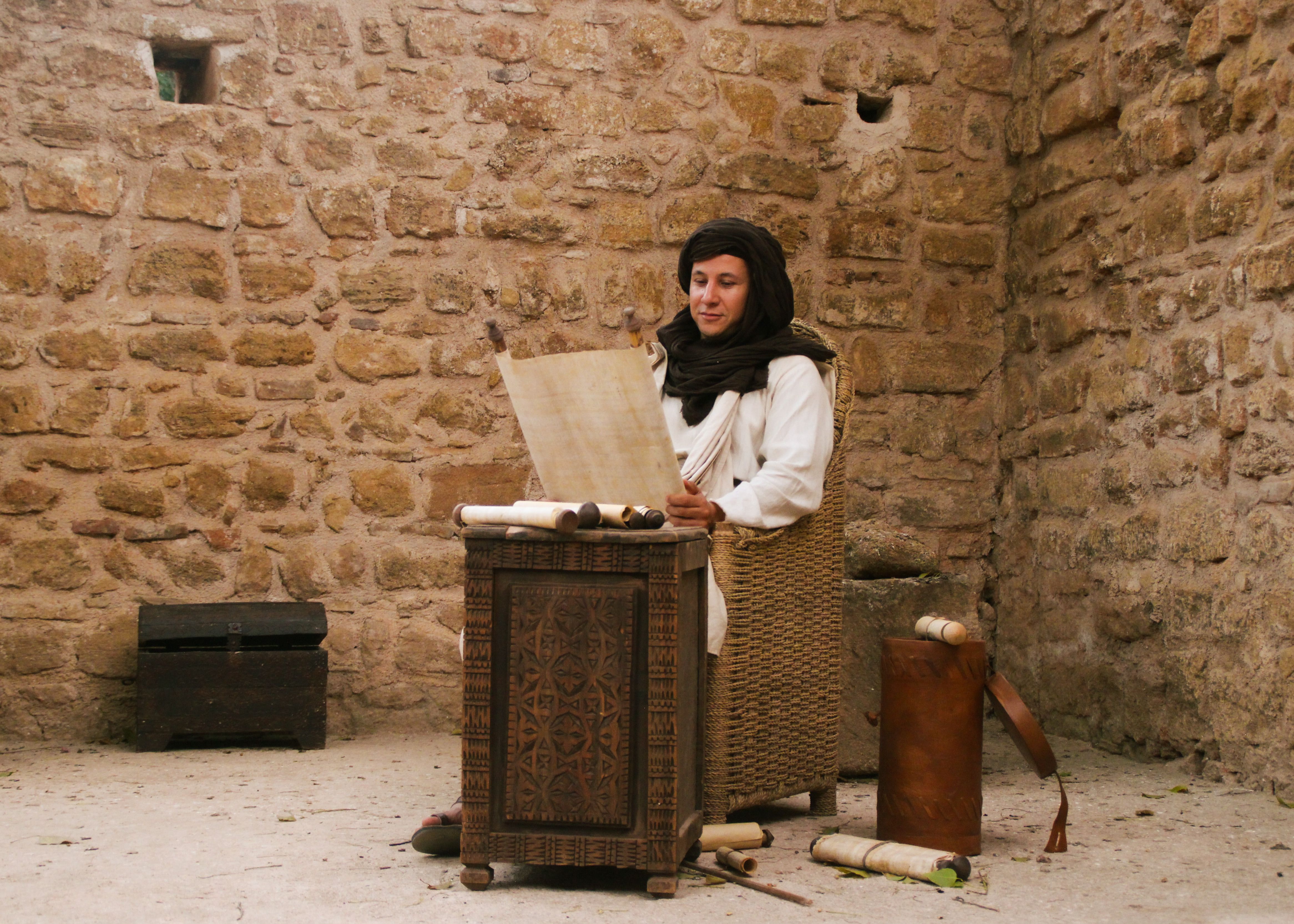 Traditional Moroccan Scribe in Historical Setting · Free Stock Photo