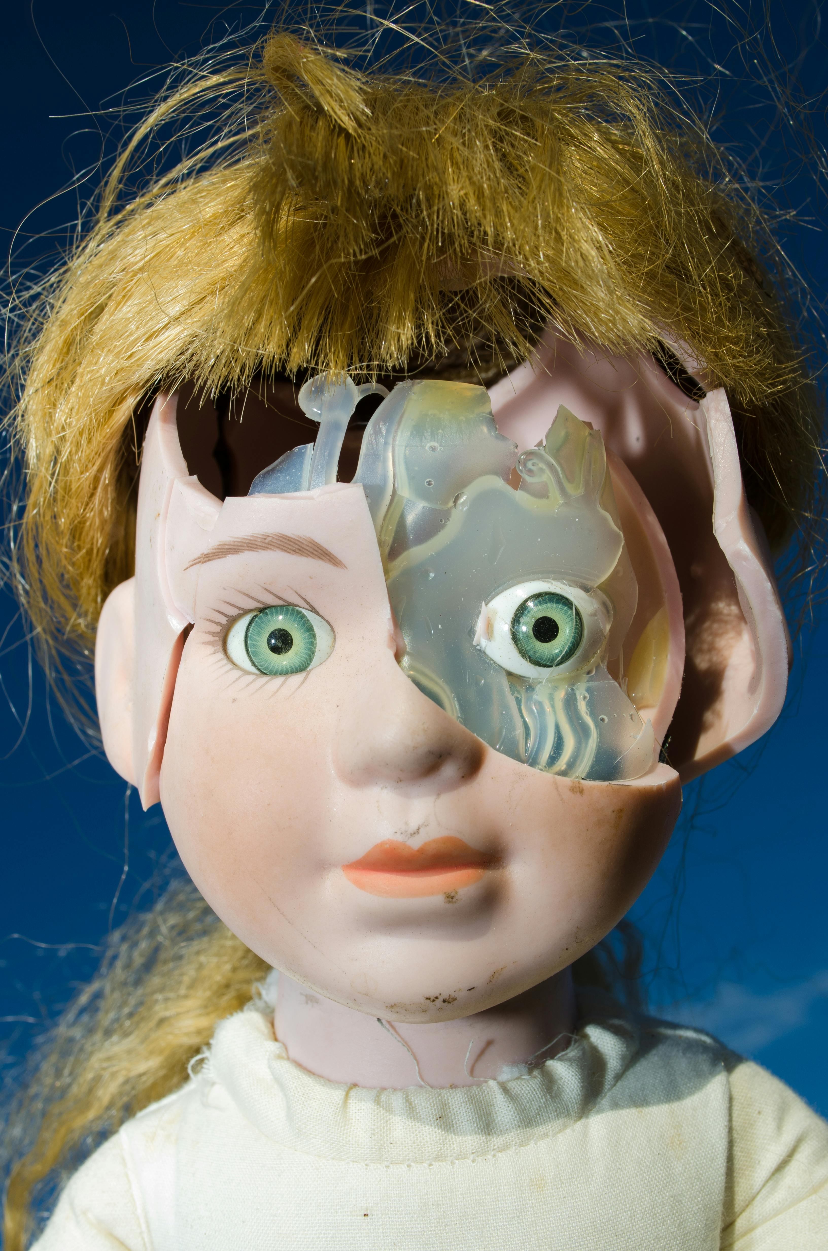 Creepy Broken Doll with Exposed Mechanism · Free Stock Photo