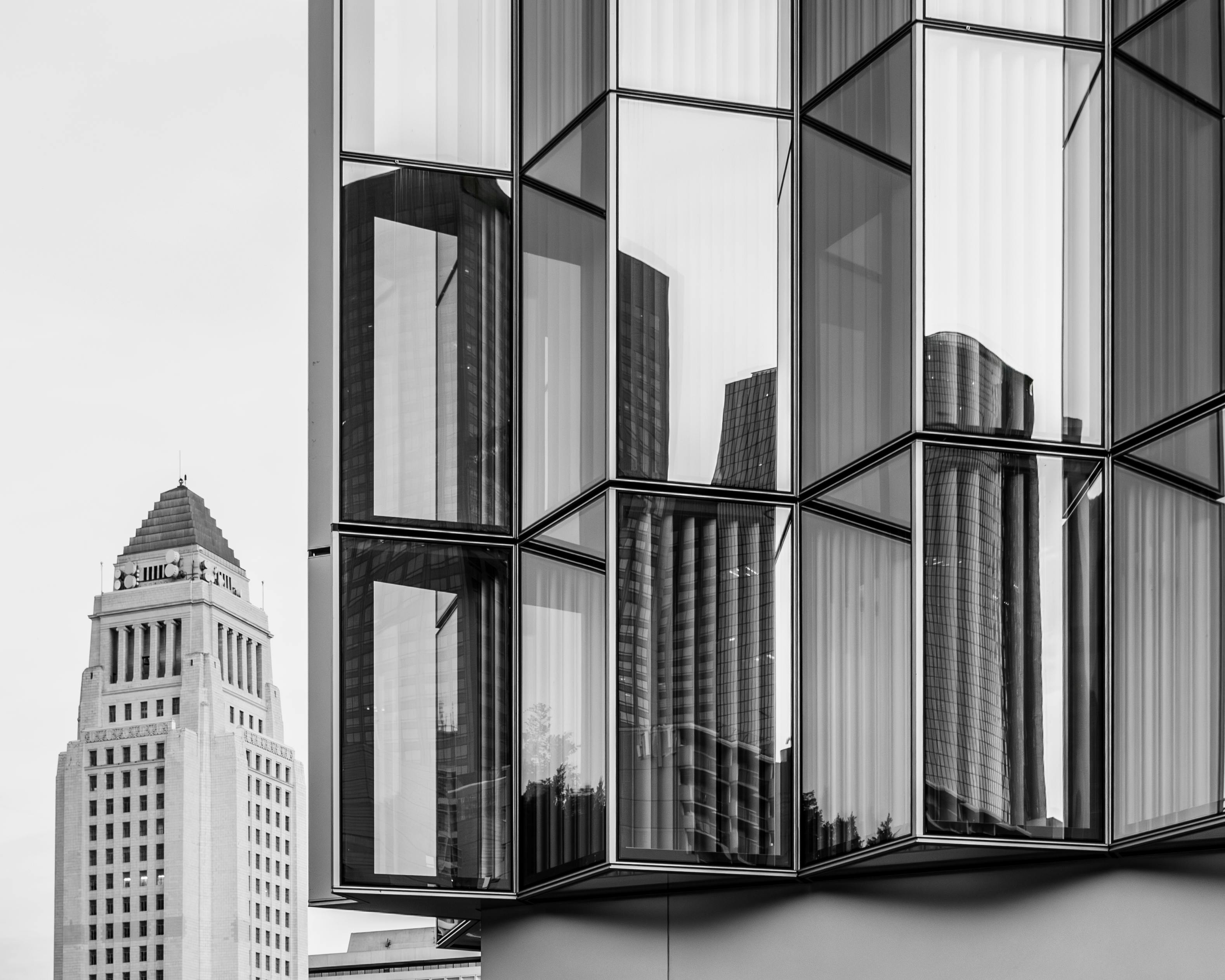 Modern Glass Facade and Iconic Building Reflection · Free Stock Photo