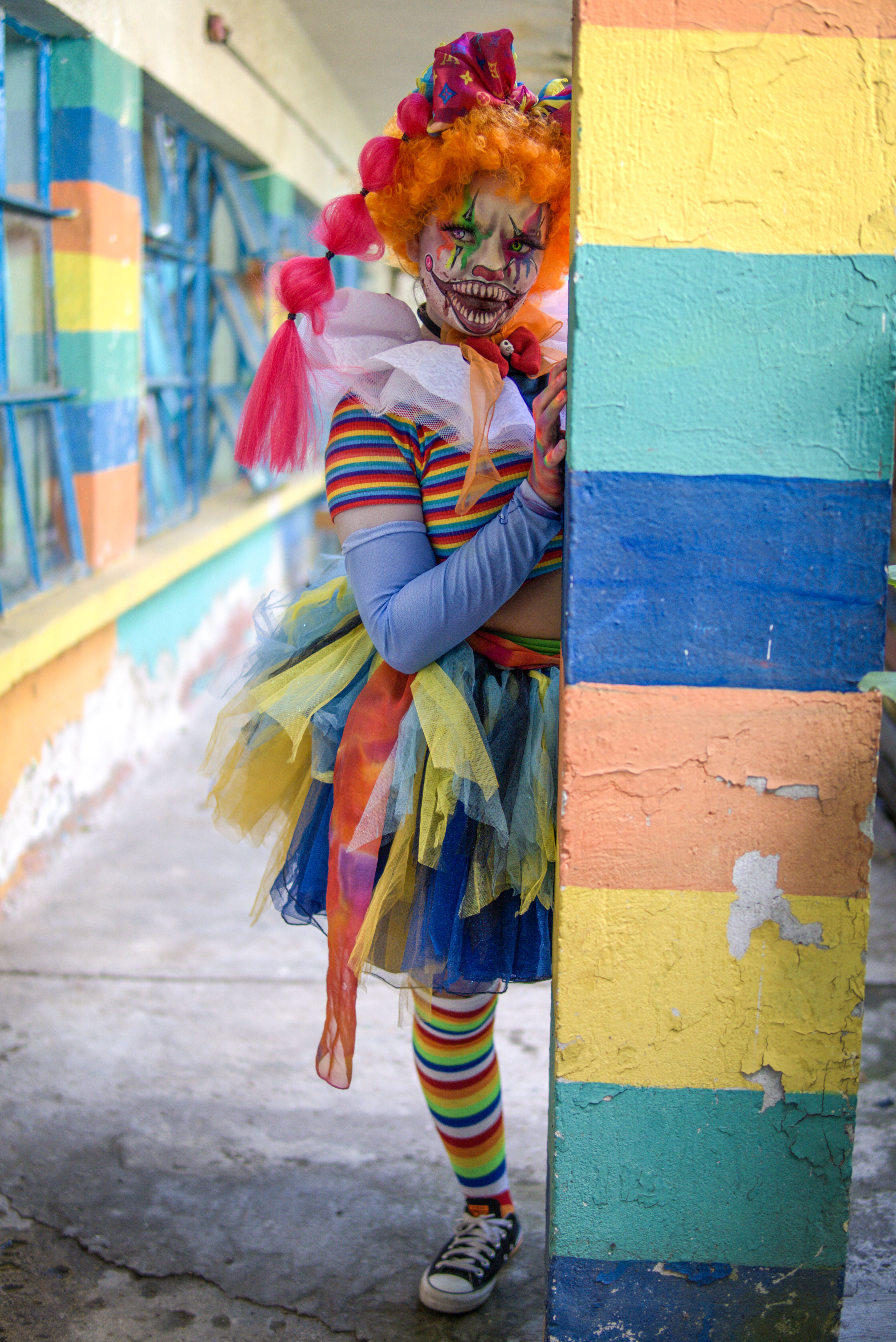 Colorful Clown in Vibrant Corridor · Free Stock Photo