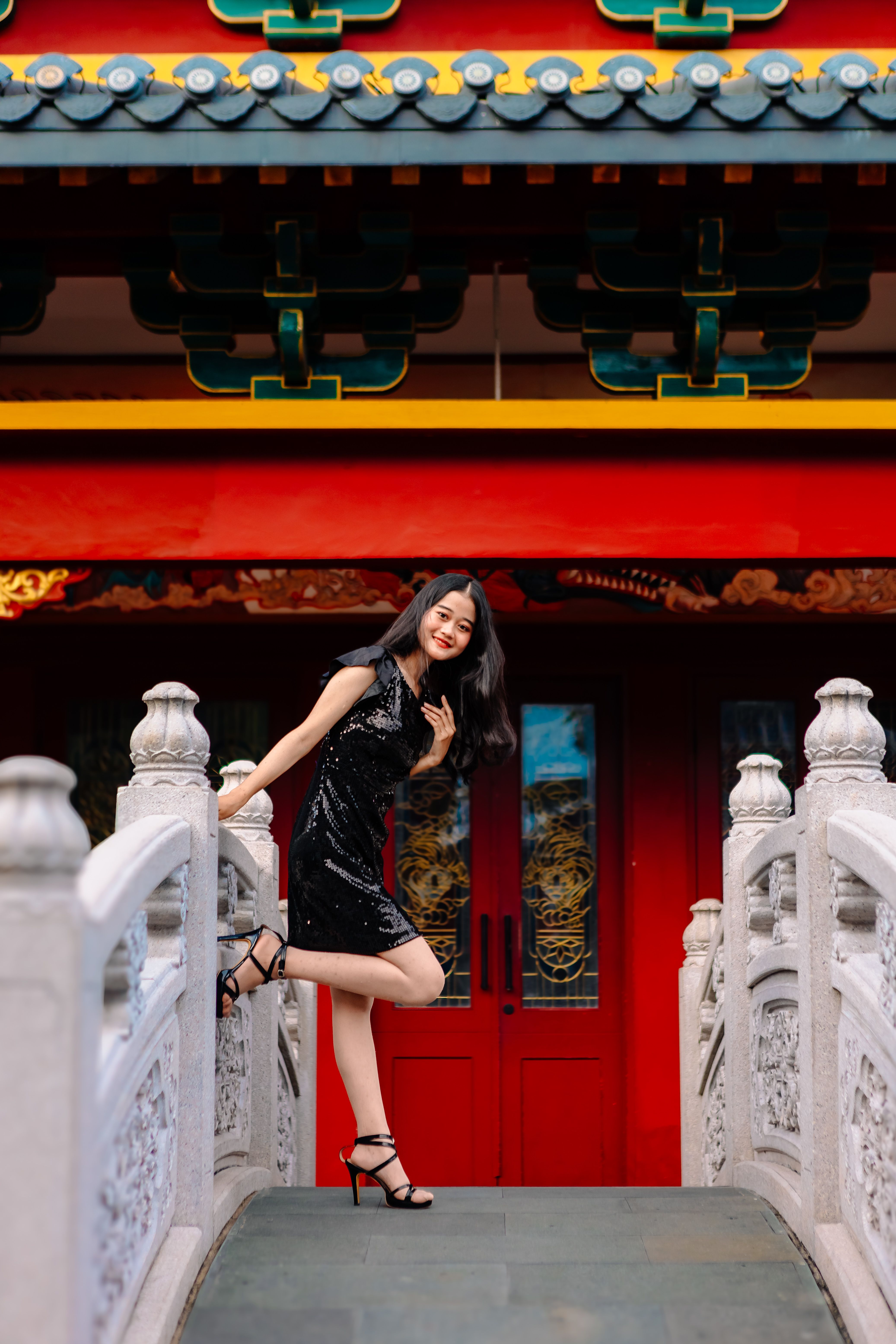 Woman Posing on Ornate Bridge in Jakarta · Free Stock Photo