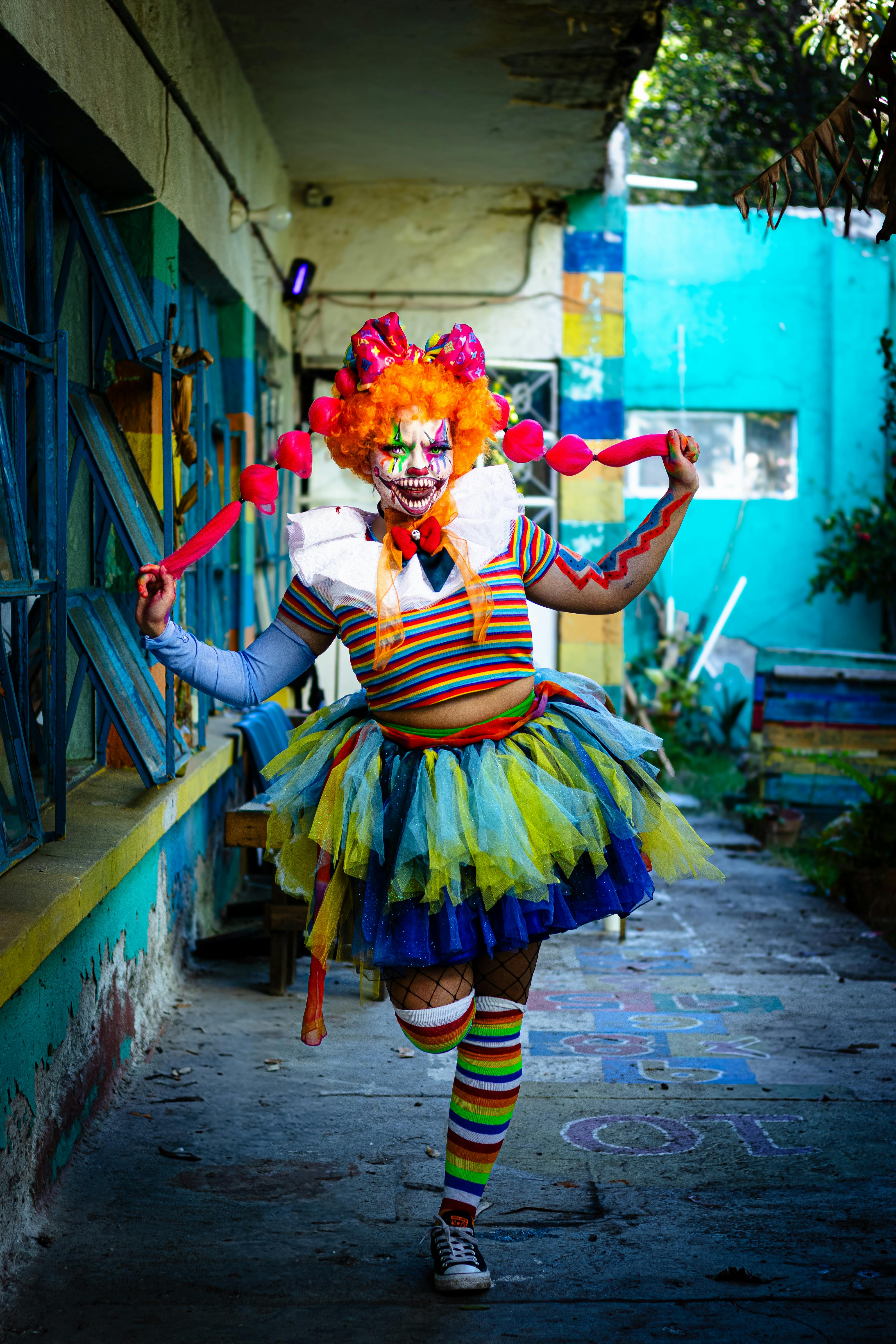 Colorful Clown Cosplay in Urban Setting · Free Stock Photo