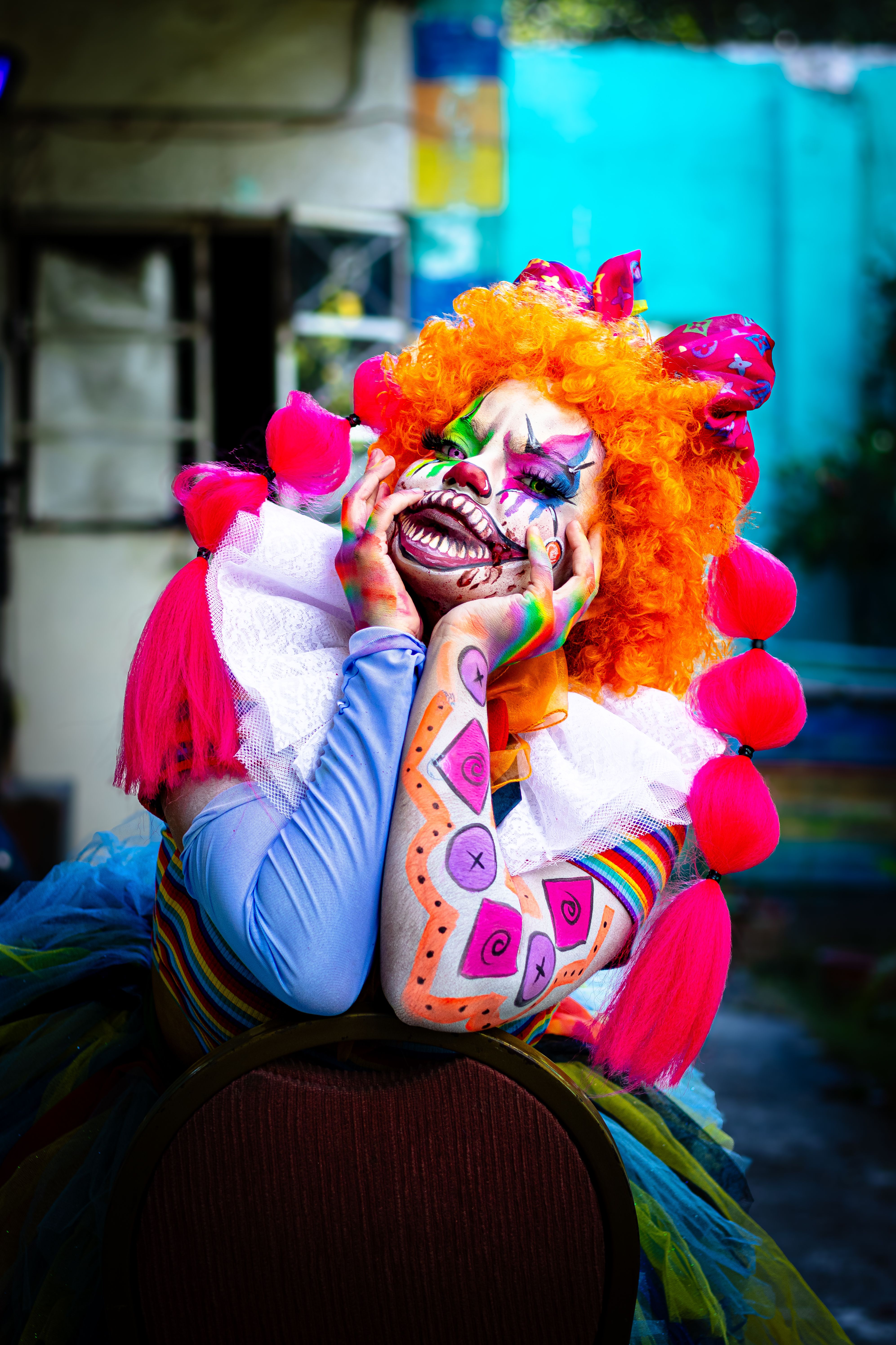 Vibrant Clown in Horror Makeup Poses Outdoors · Free Stock Photo