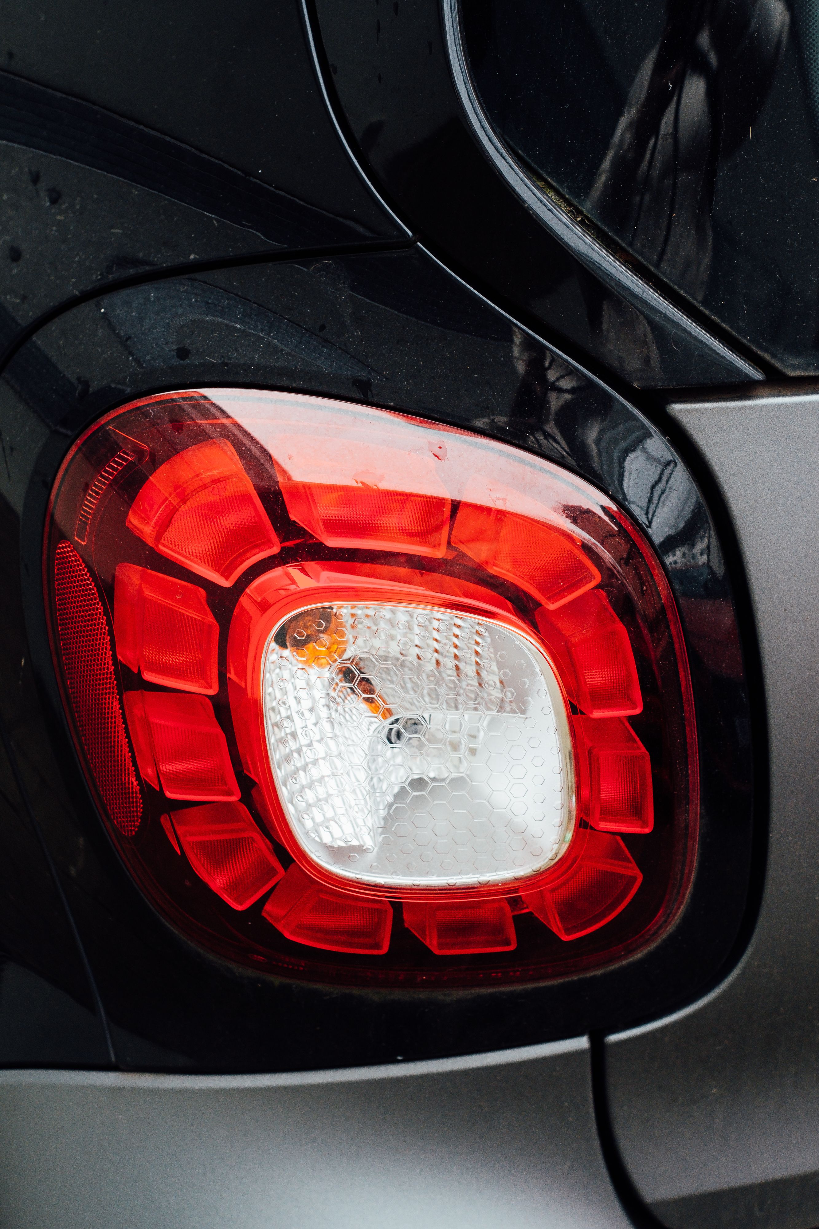 Close-up of a Modern Car Tail Light at Night · Free Stock Photo