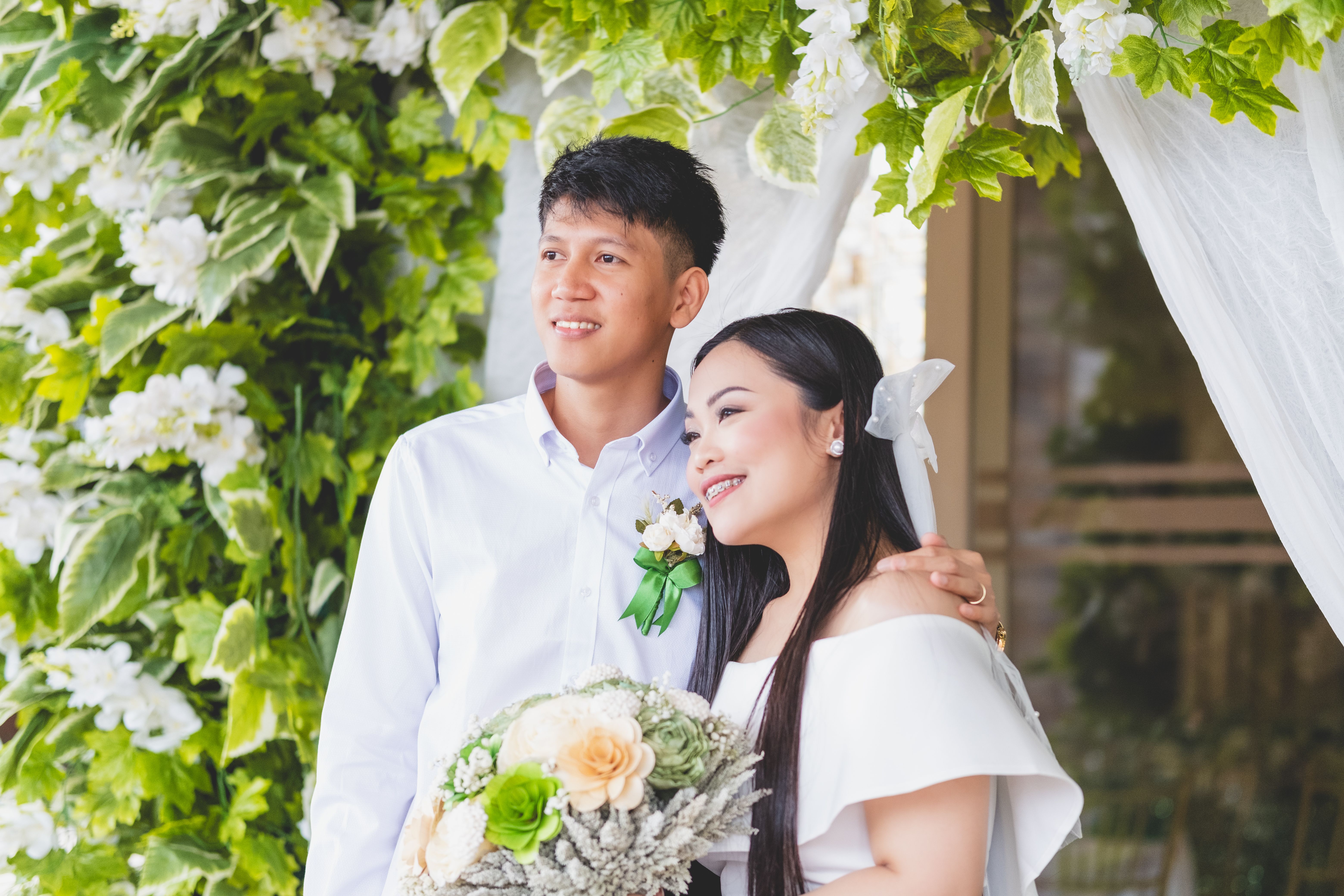Charming Wedding Couple in Floral Setting · Free Stock Photo