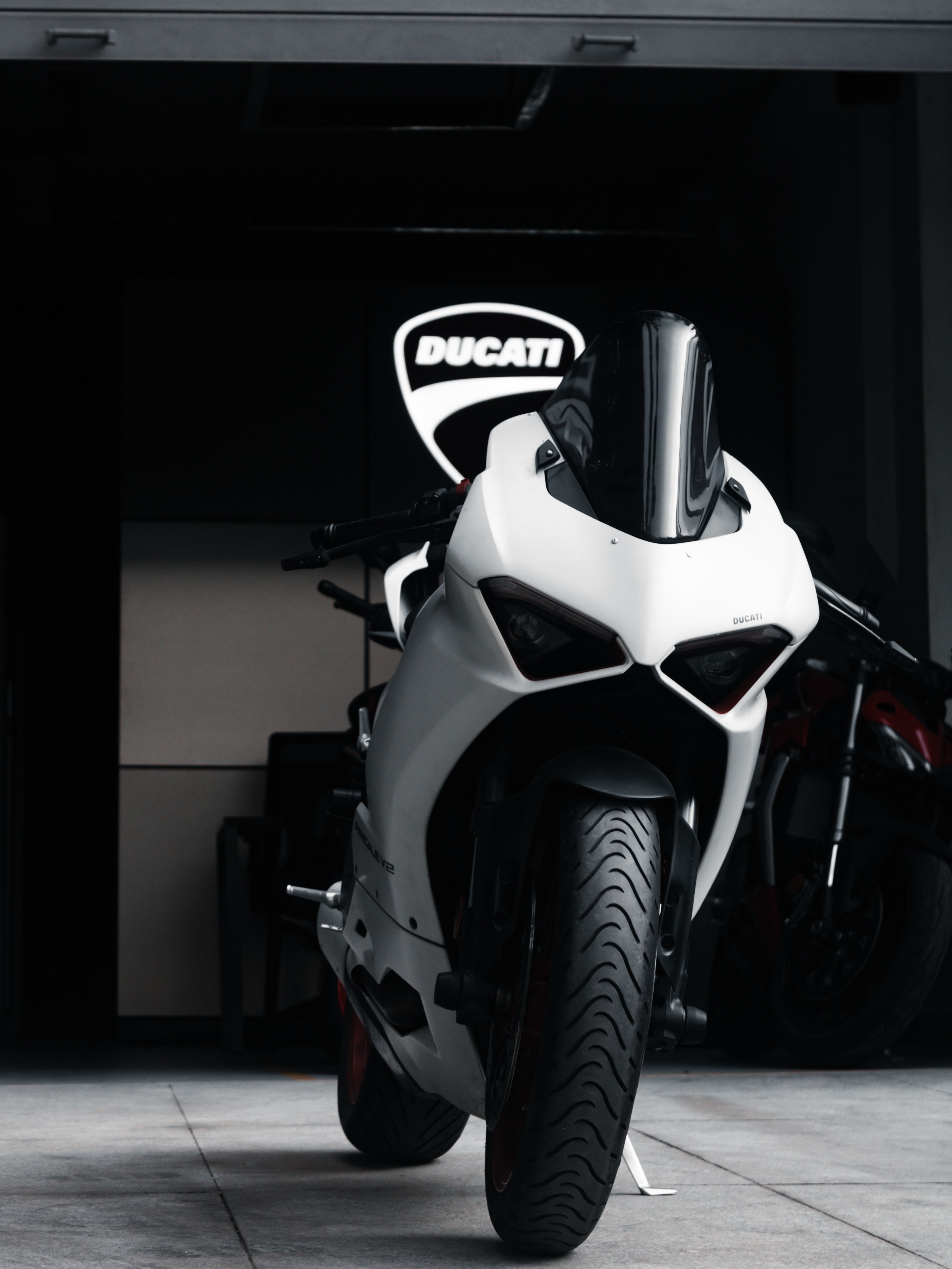 Sleek White Ducati Superbike in Garage · Free Stock Photo