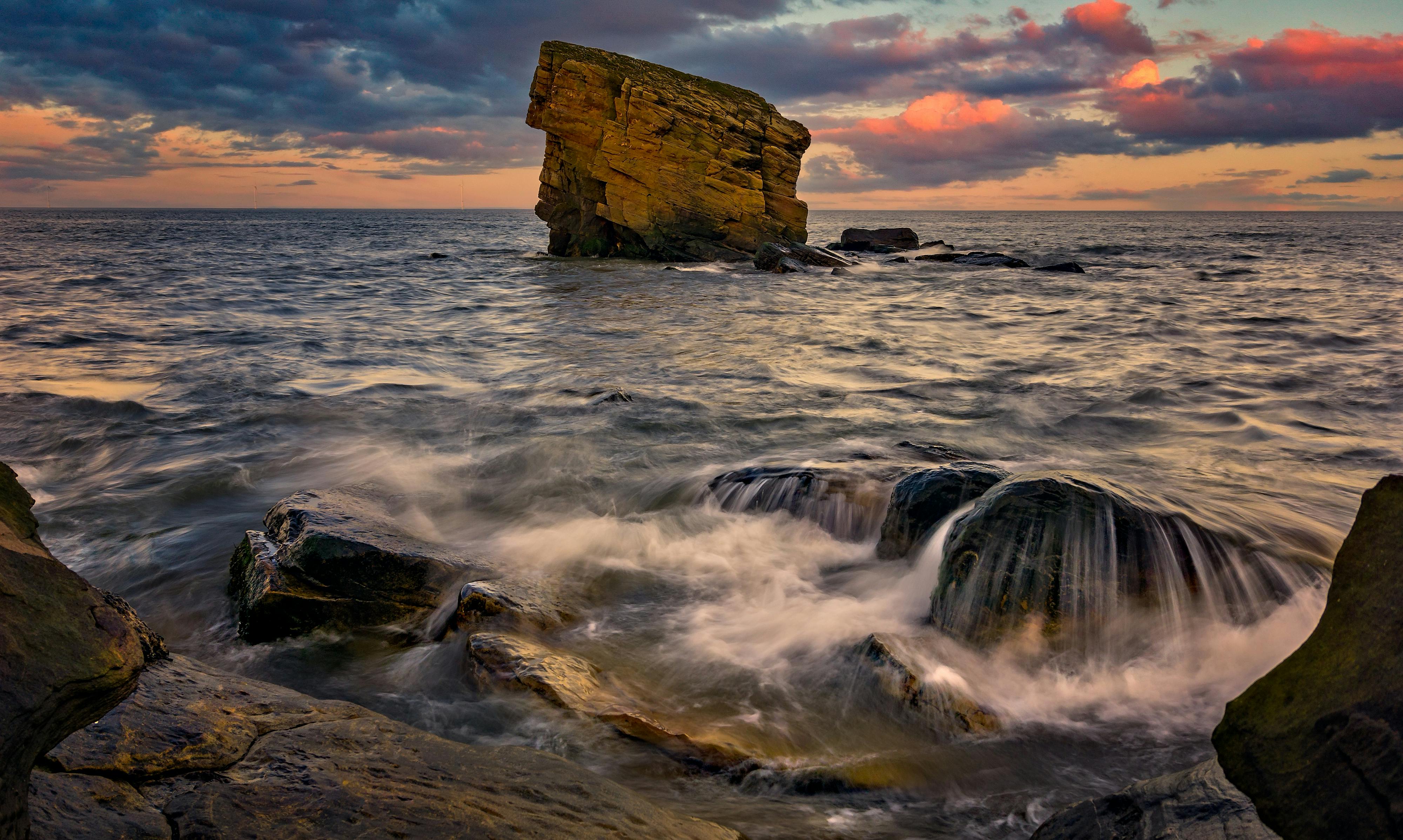 Dramatic Ocean Sunset with Coastal Rock Formation · Free Stock Photo