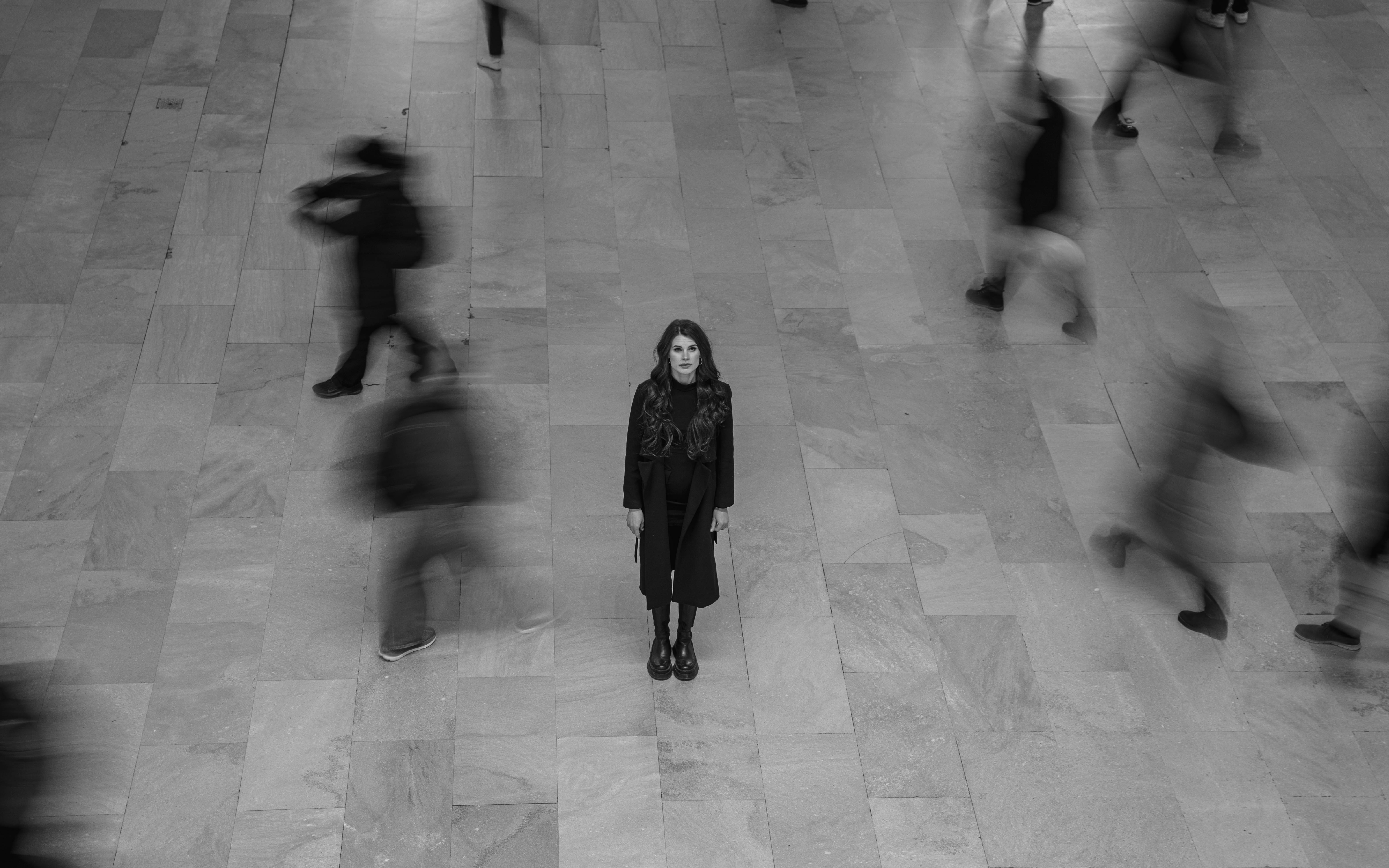 Lonely Woman in Bustling New York Terminal · Free Stock Photo