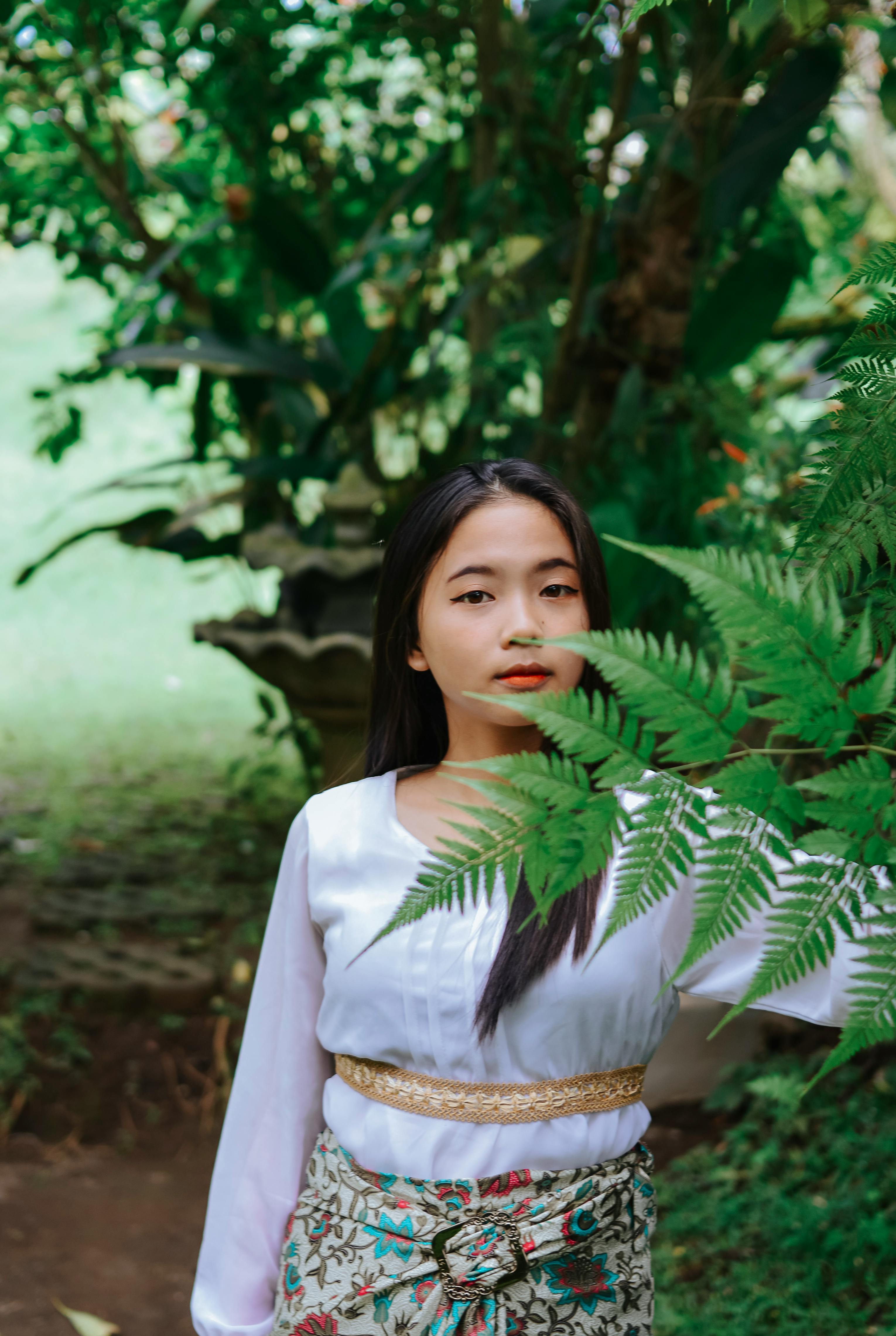 Young Woman in Traditional Indonesian Attire Outdoors · Free Stock Photo