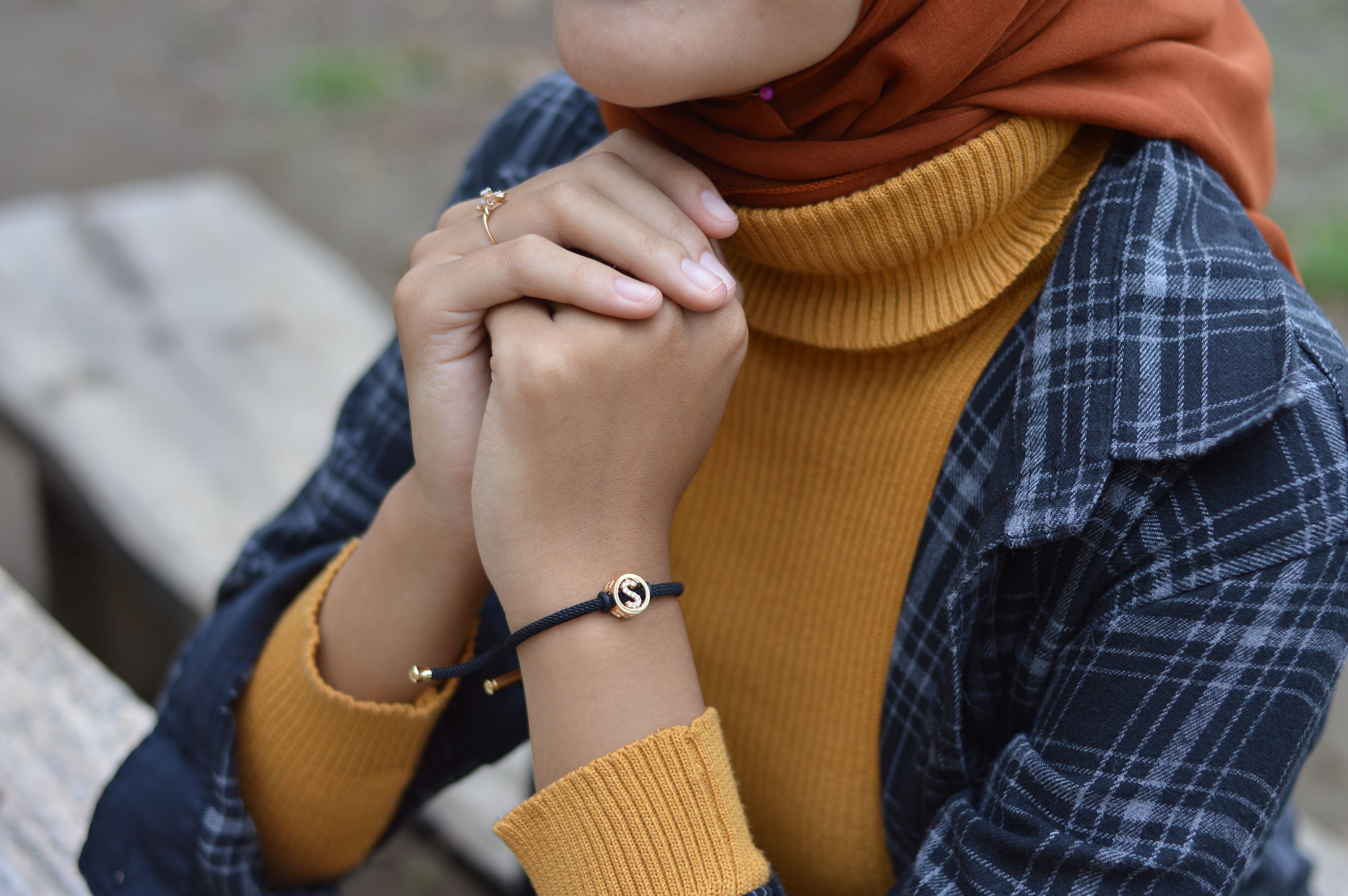 Woman in Hijab with Orange Sweater and Plaid Jacket · Free Stock Photo