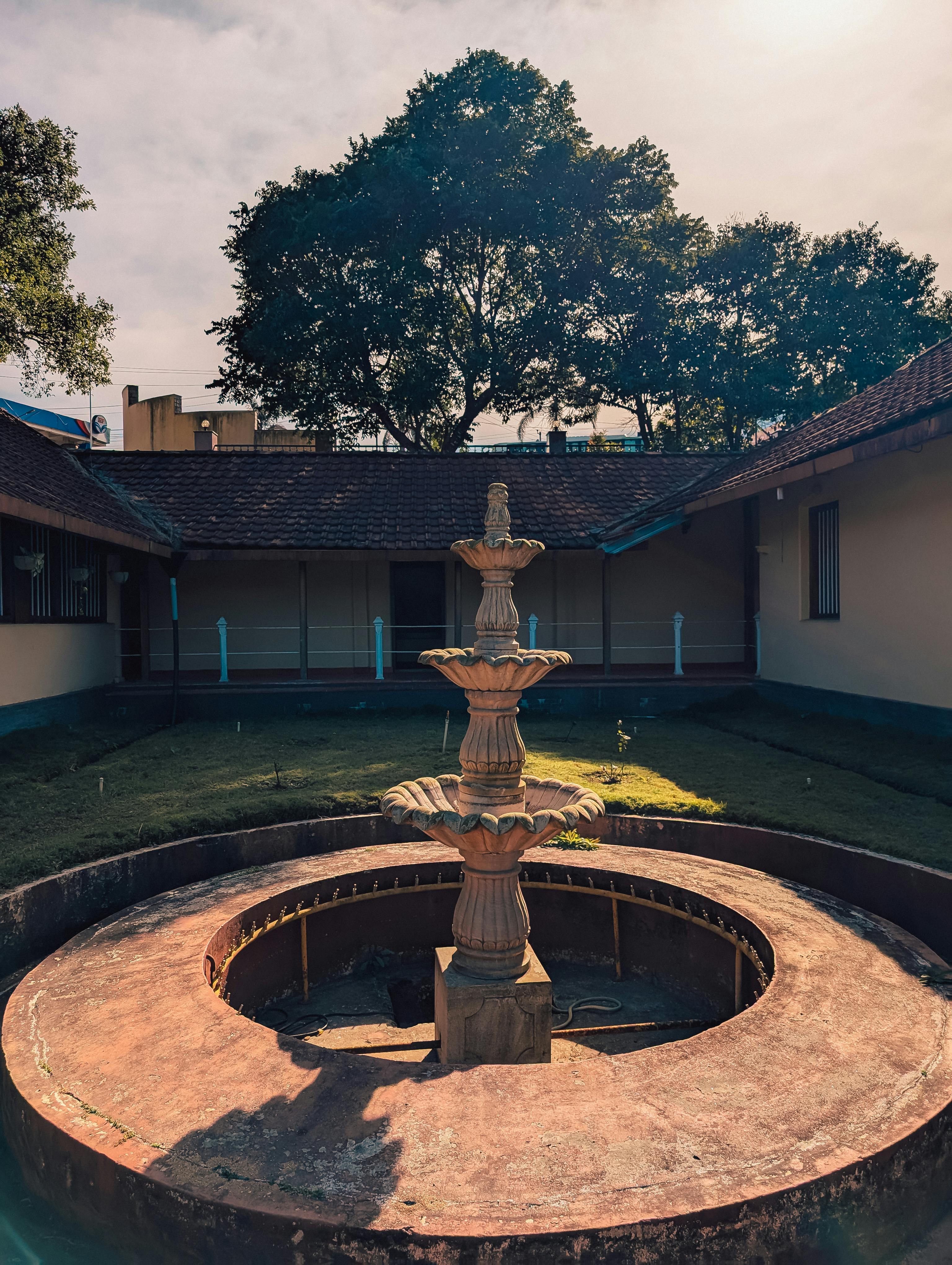 Tranquil Courtyard Scene with Central Fountain · Free Stock Photo