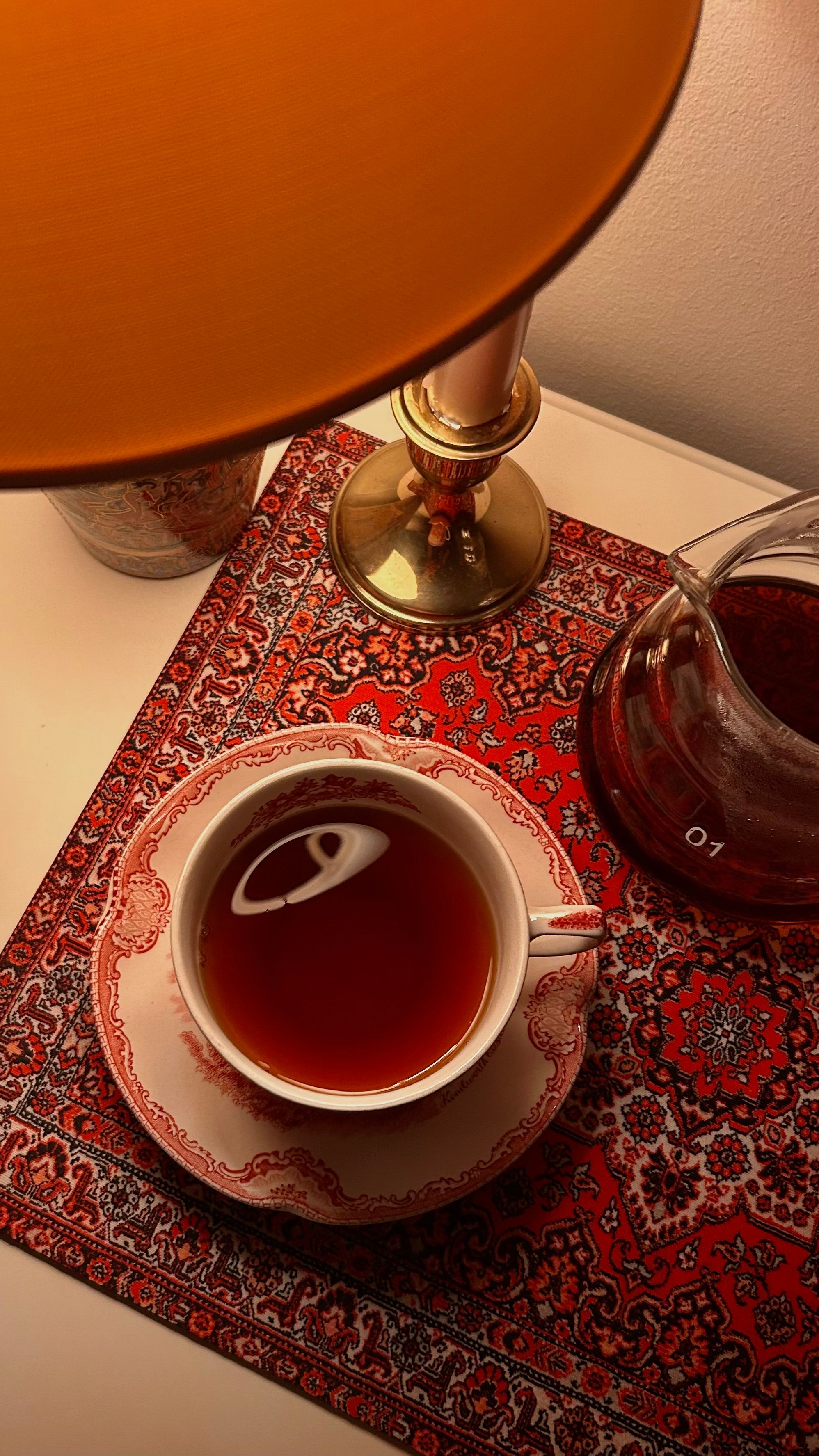 Cozy Evening with Tea on Ornate Table · Free Stock Photo