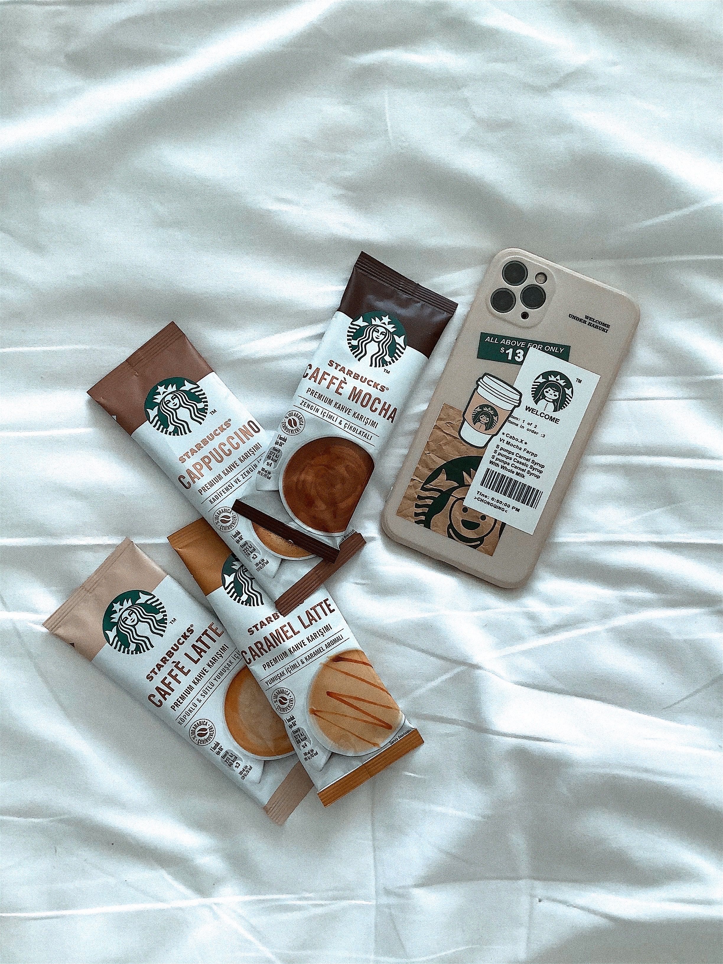 Assorted Coffee Packs on White Background · Free Stock Photo