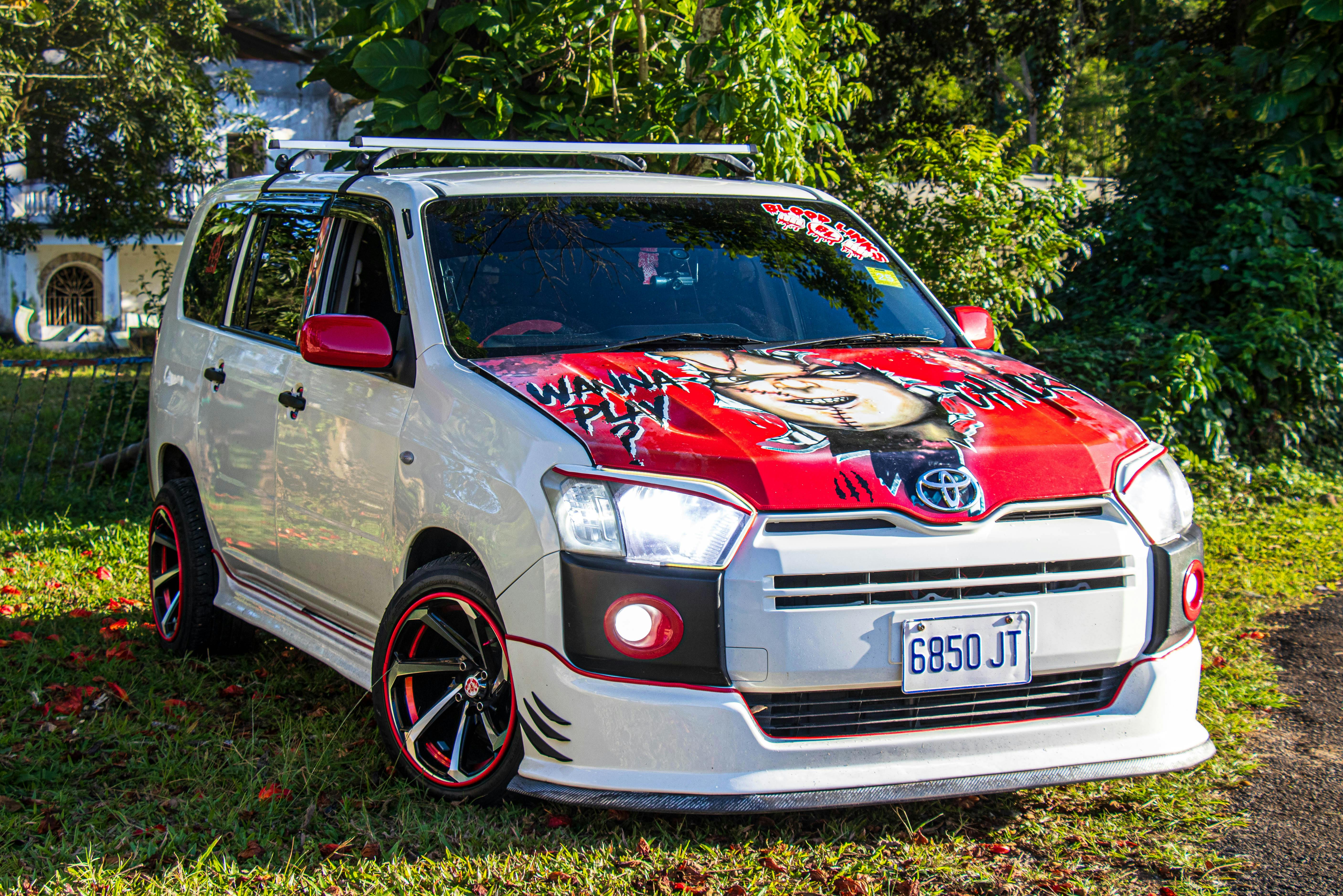 Customized Car with Bold Hood Art in Jamaica · Free Stock Photo