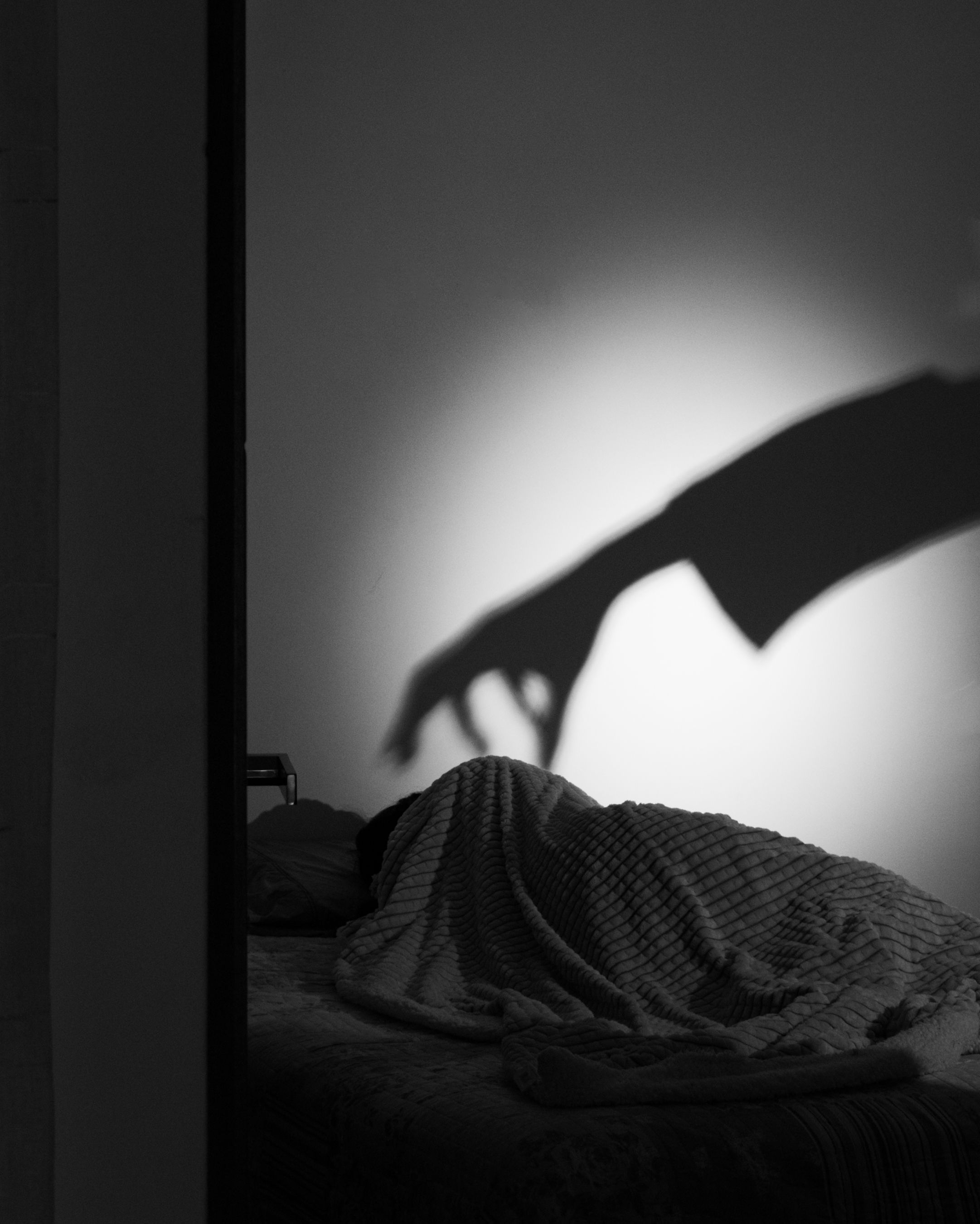 Mysterious Shadow Cast on Bedroom Wall in Black and White · Free Stock ...