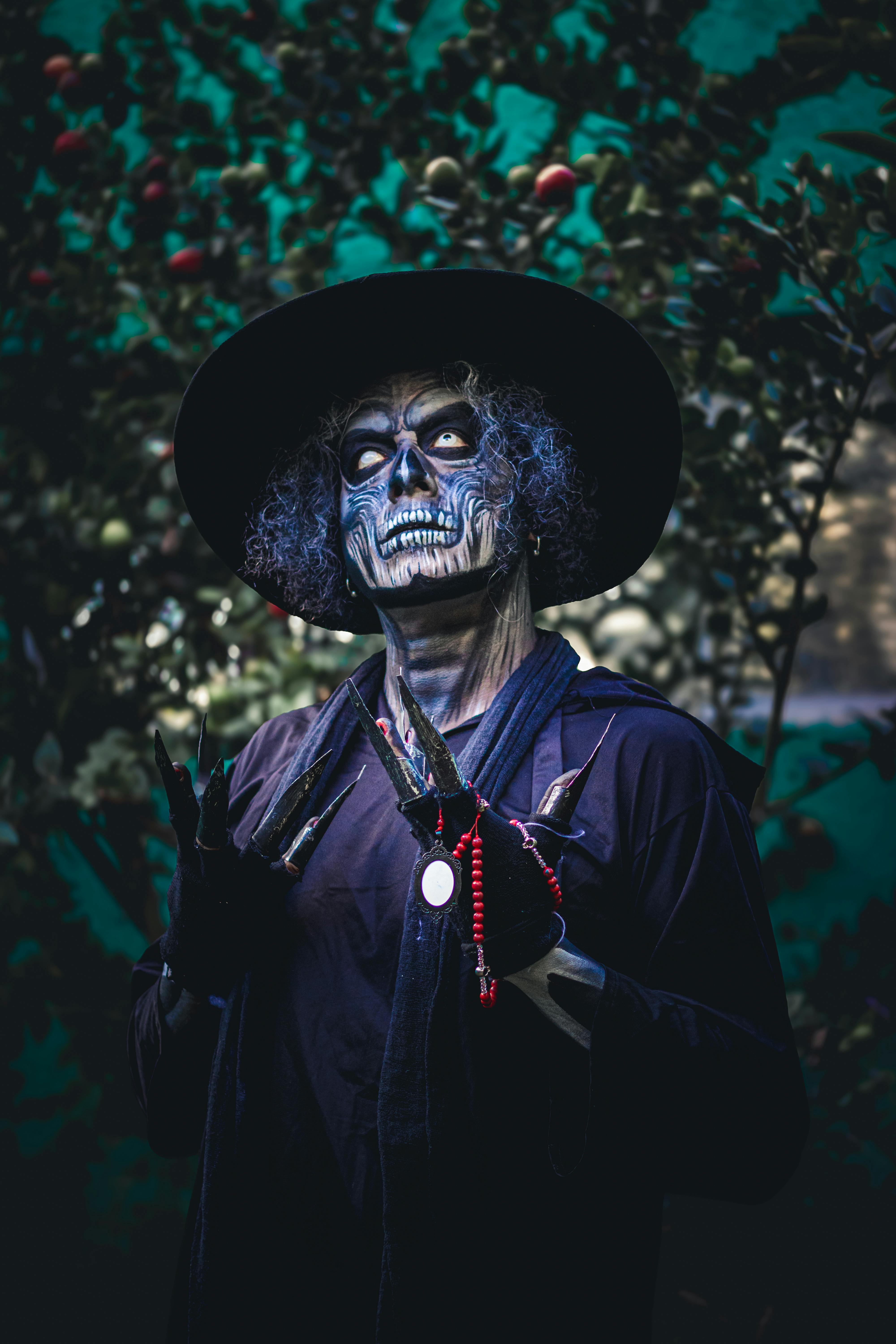 Mysterious Costume with Skull Makeup Outdoors · Free Stock Photo