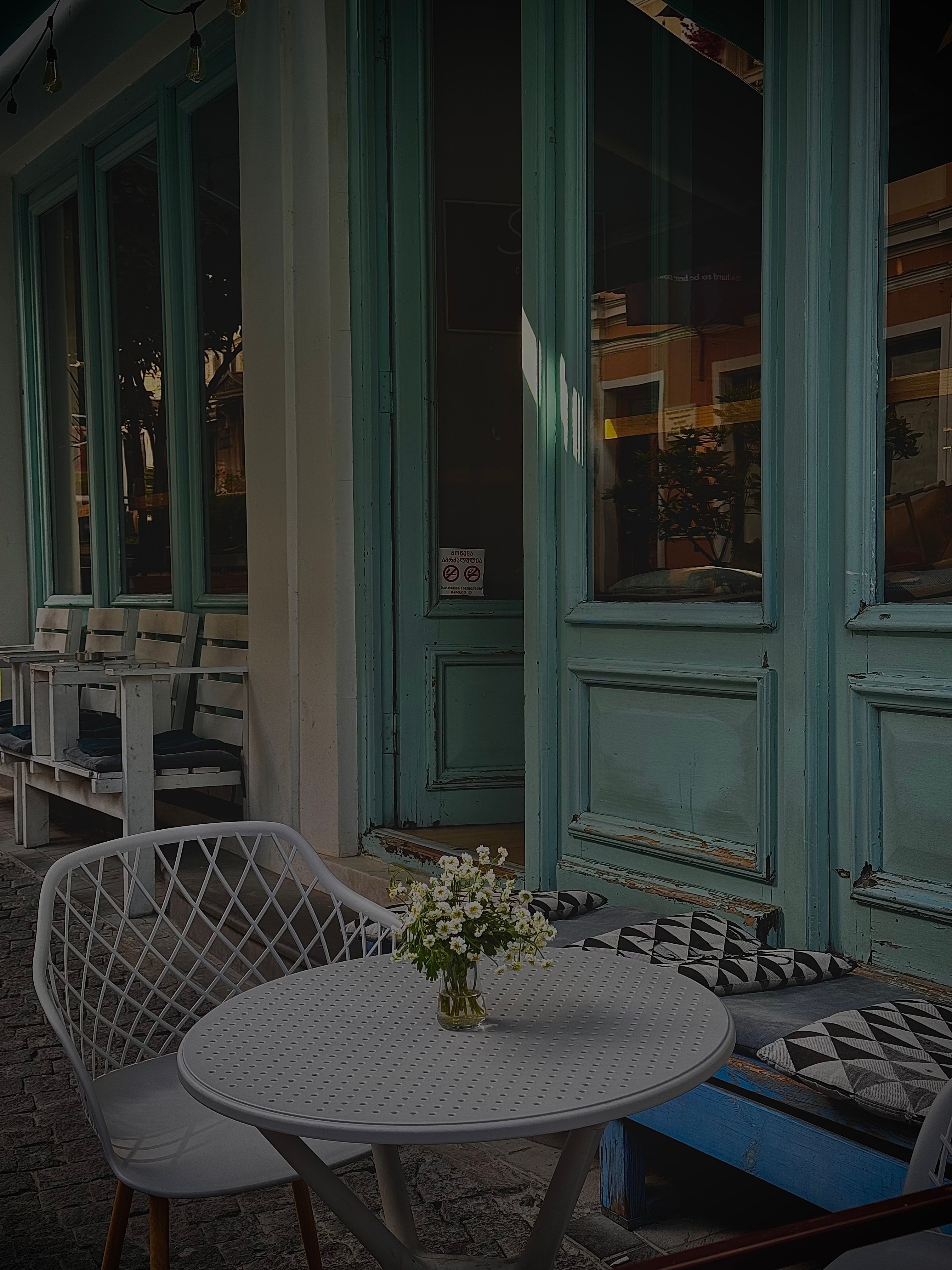 Charming Outdoor Cafe with Blue Facade in Tbilisi · Free Stock Photo