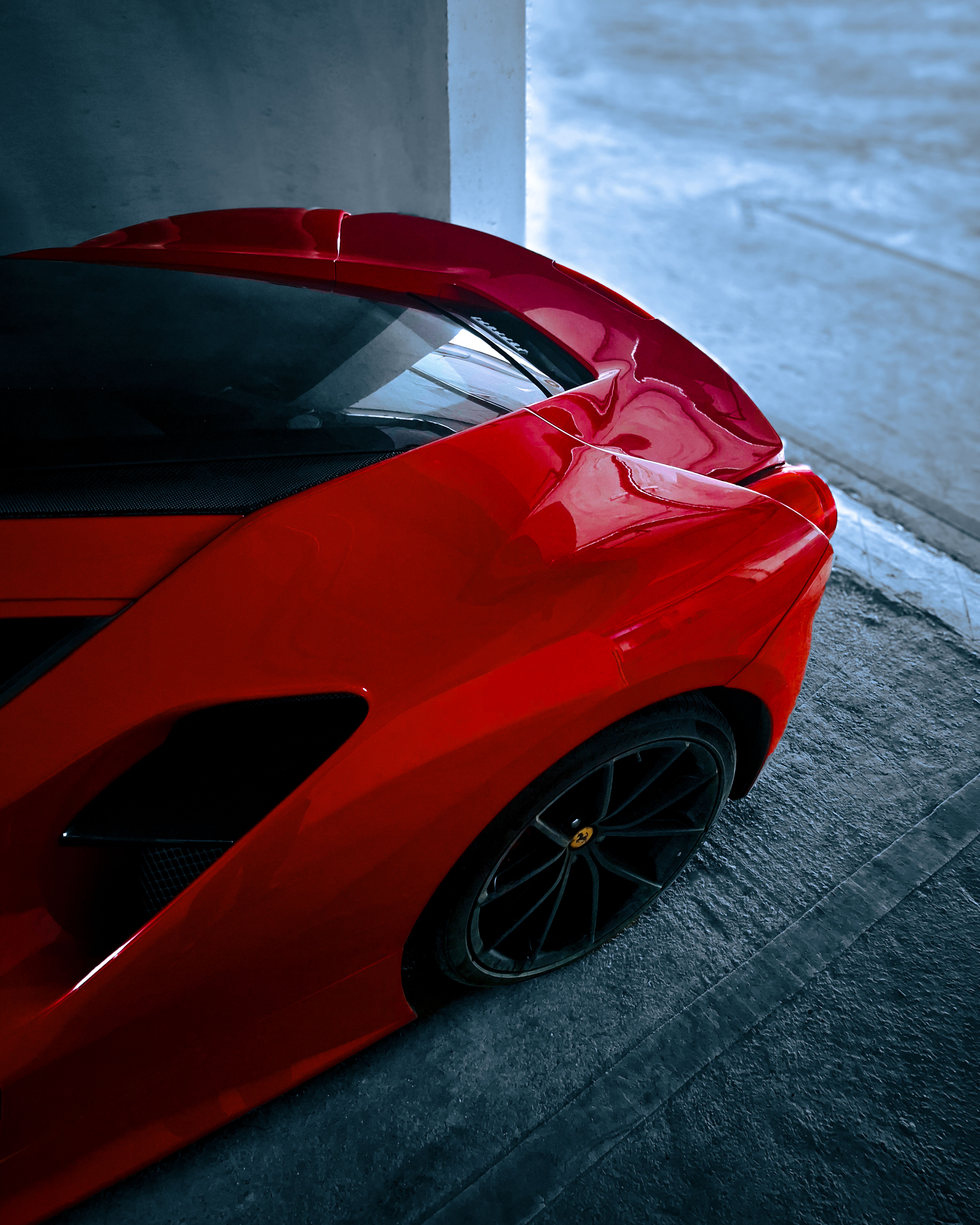 Vibrant Red Sports Car in a Modern Setting · Free Stock Photo