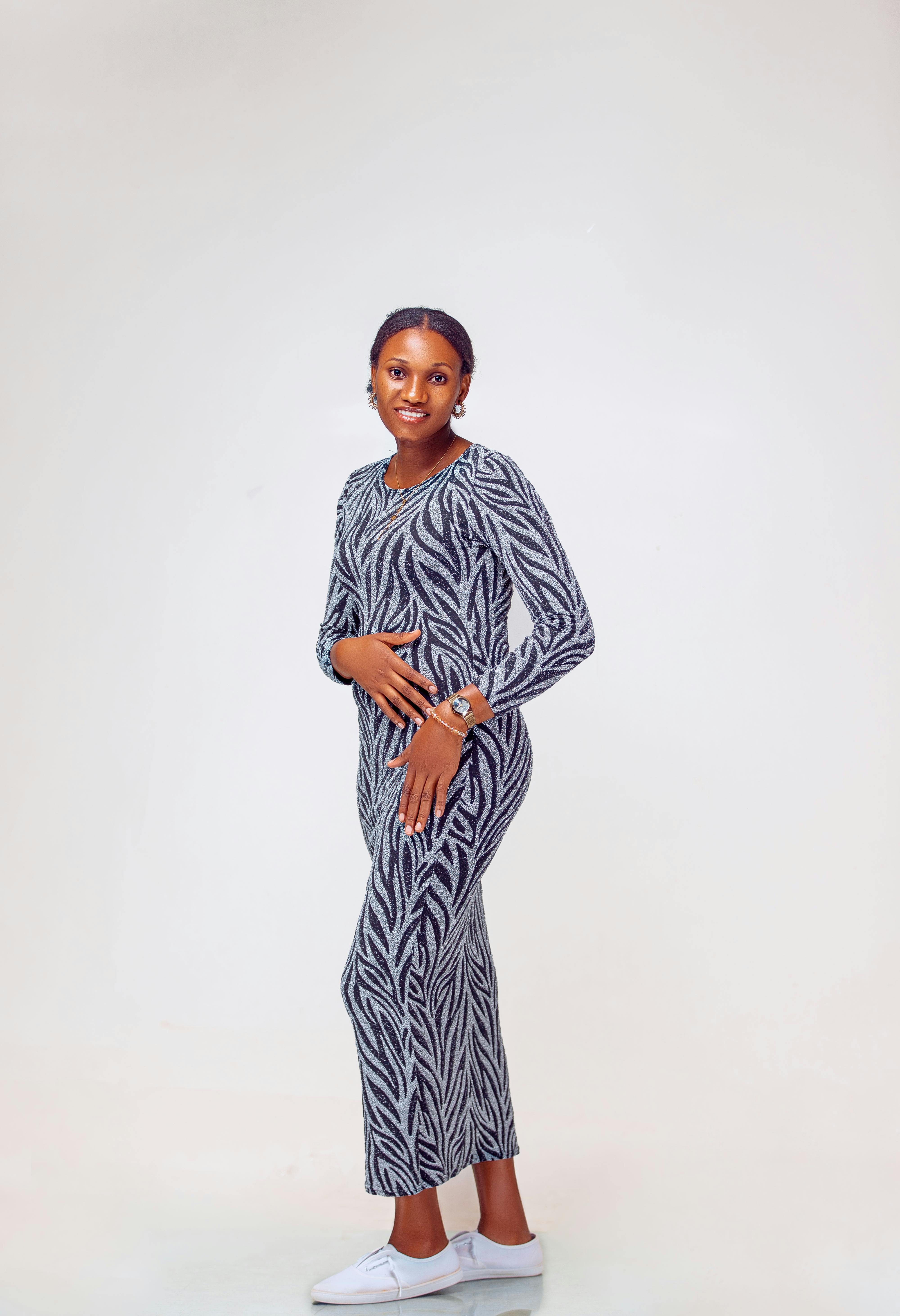 Stylish Woman in Zebra Pattern Dress · Free Stock Photo